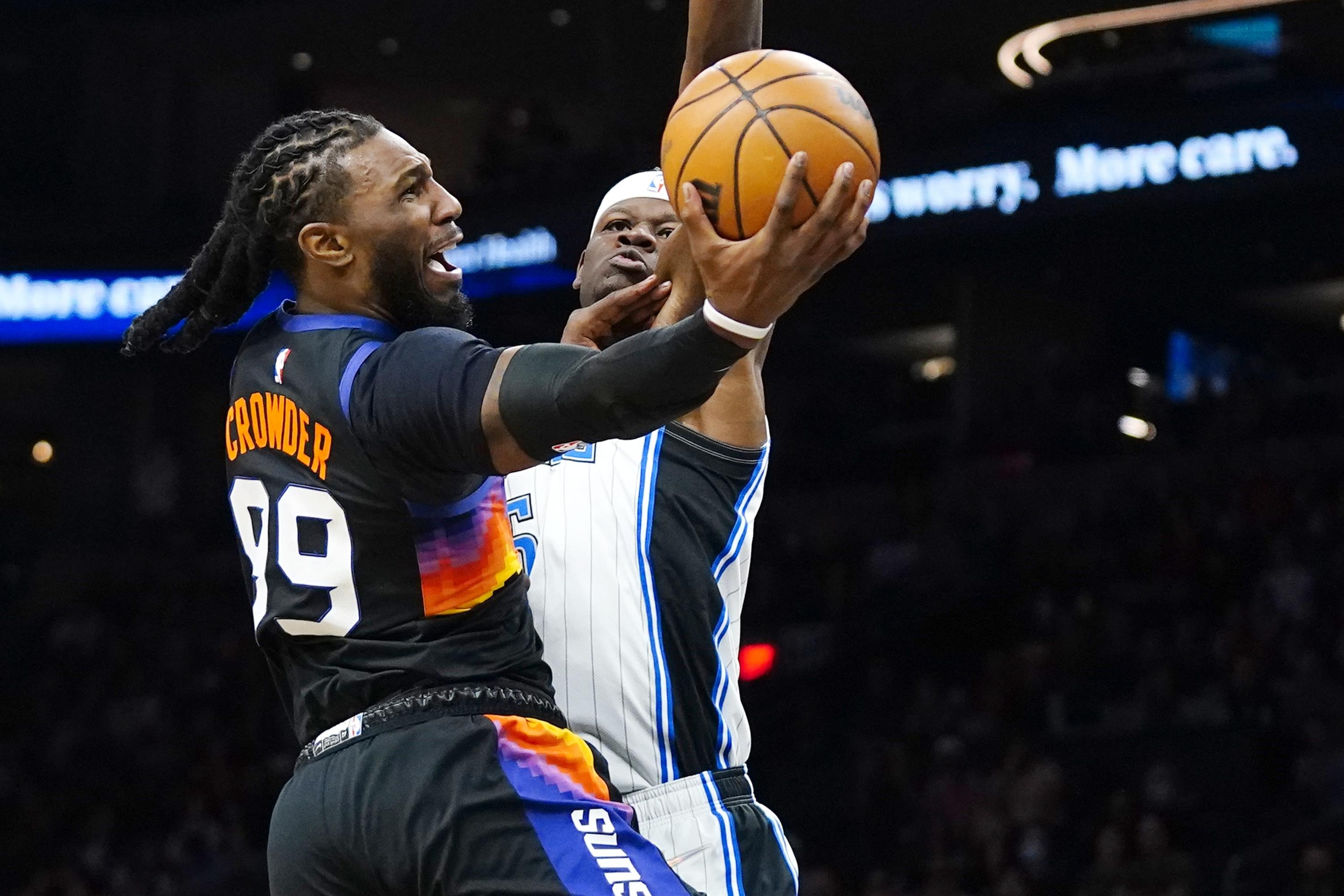 Devin Booker helps NBA-leading Suns past Magic 132-105 | AP News