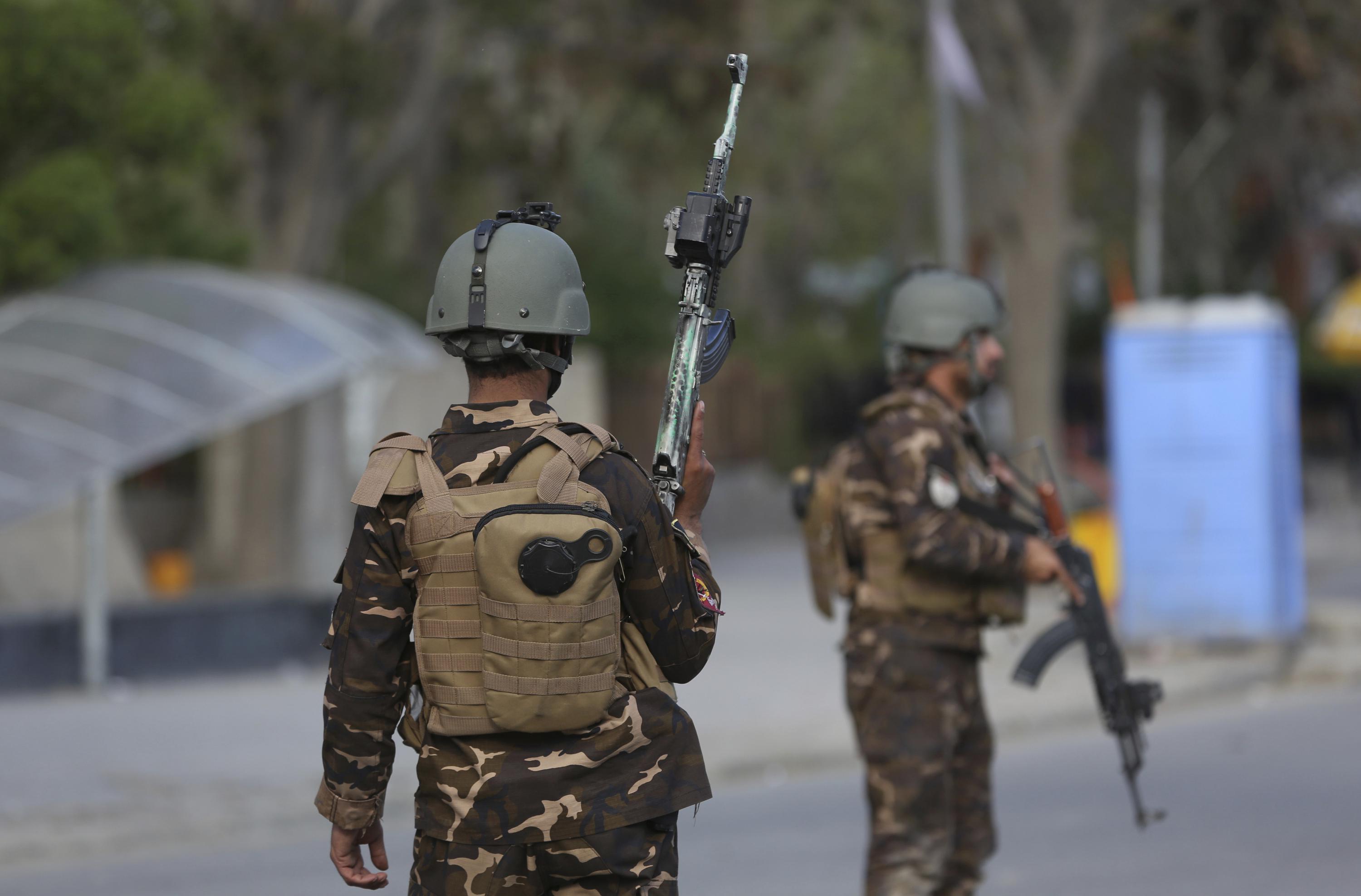 Afghan official says Taliban ambush police convoy, kill 9 | AP News