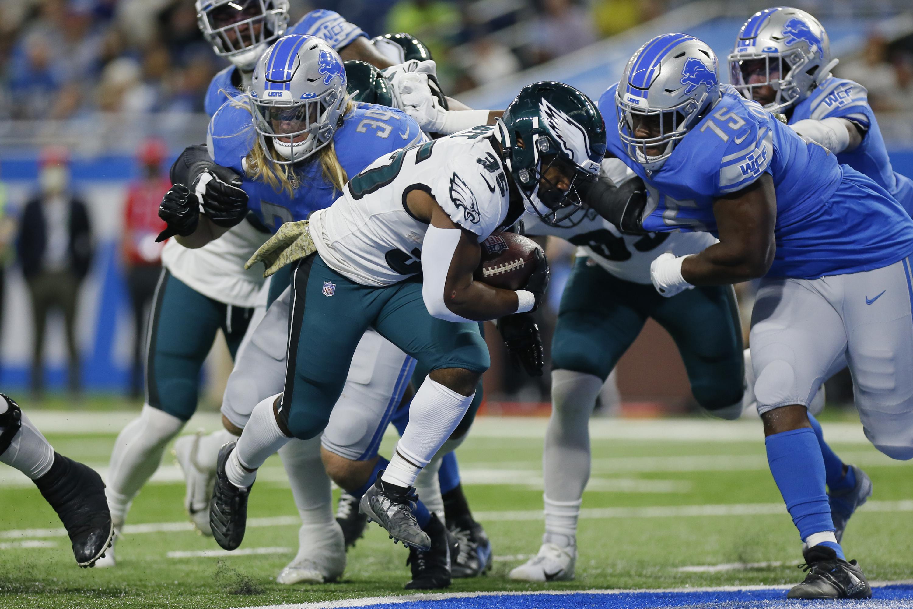 Eagles run for 4 TDs in 44-6 victory over winless Lions | AP News