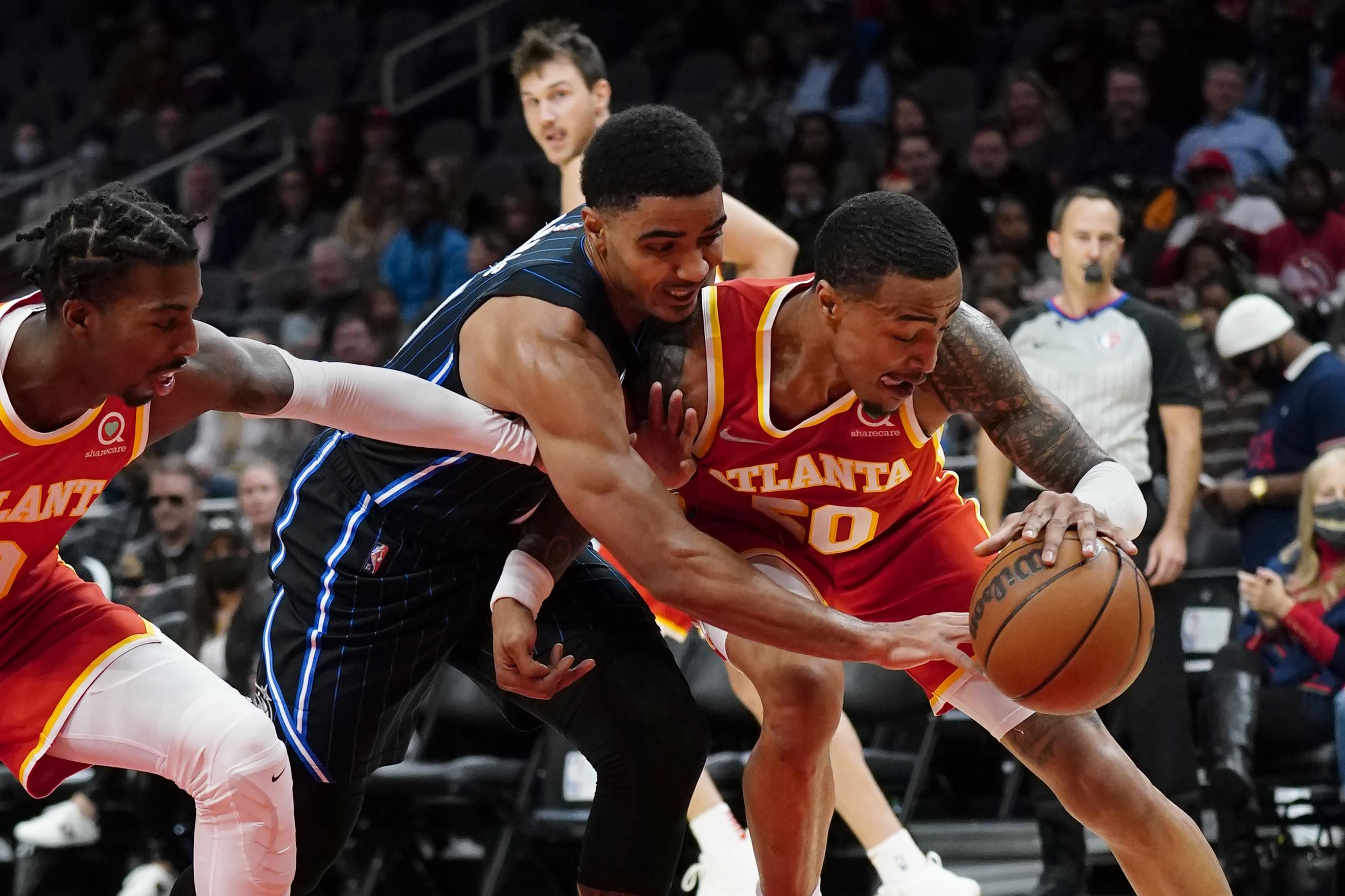 Young, Collins each score 23 as Hawks beat Magic 129-111 | AP News