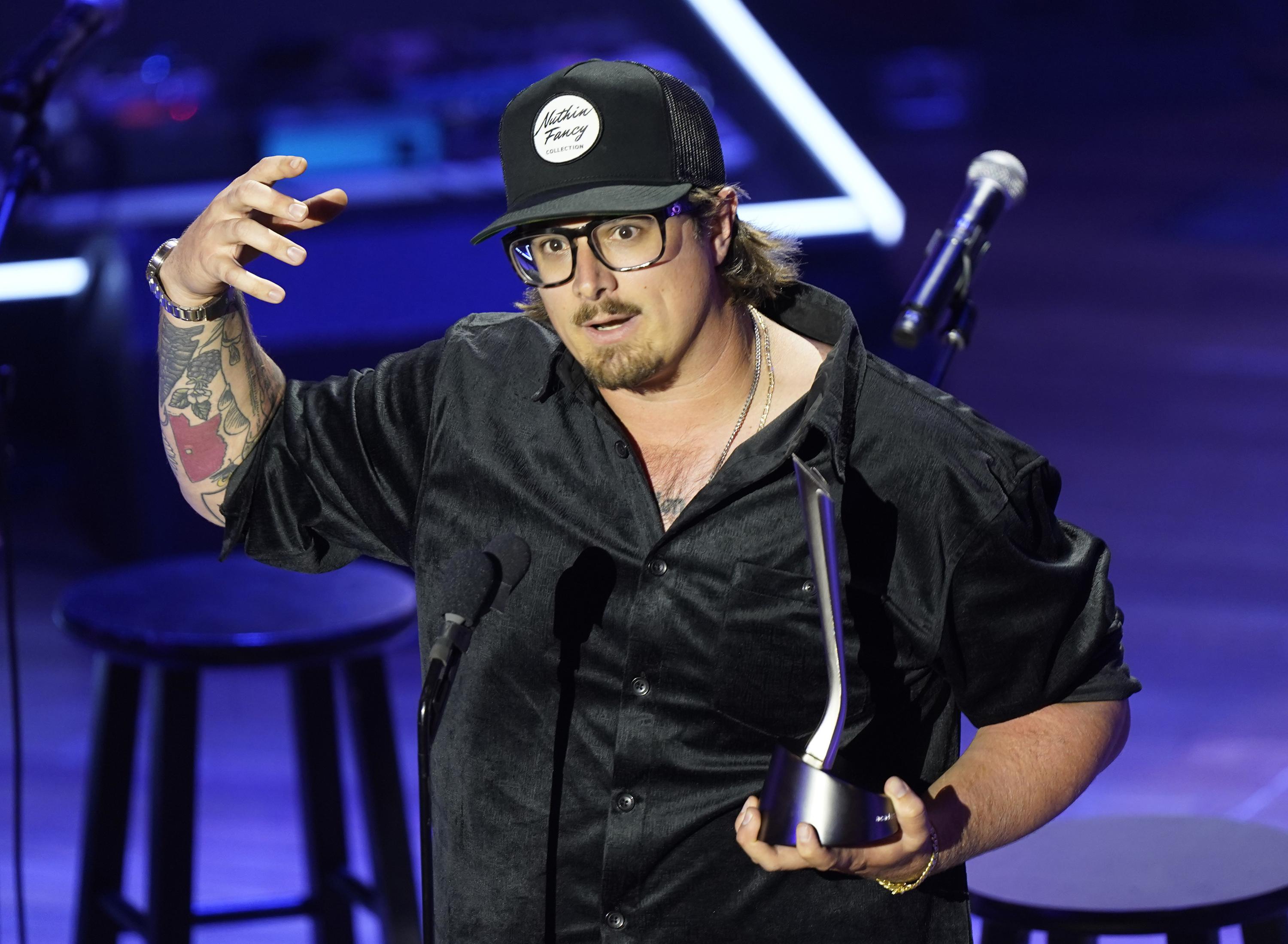 Tour bus crash injures musician Hardy, 3 others | AP News