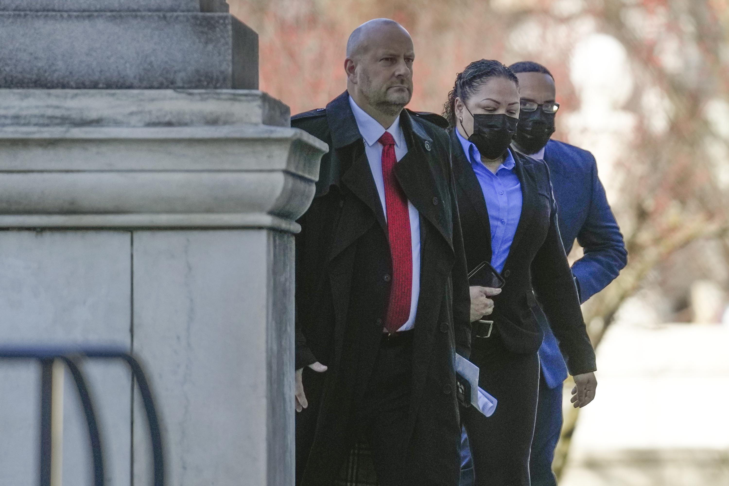 5 officers charged in police van injury case appear in court | AP News