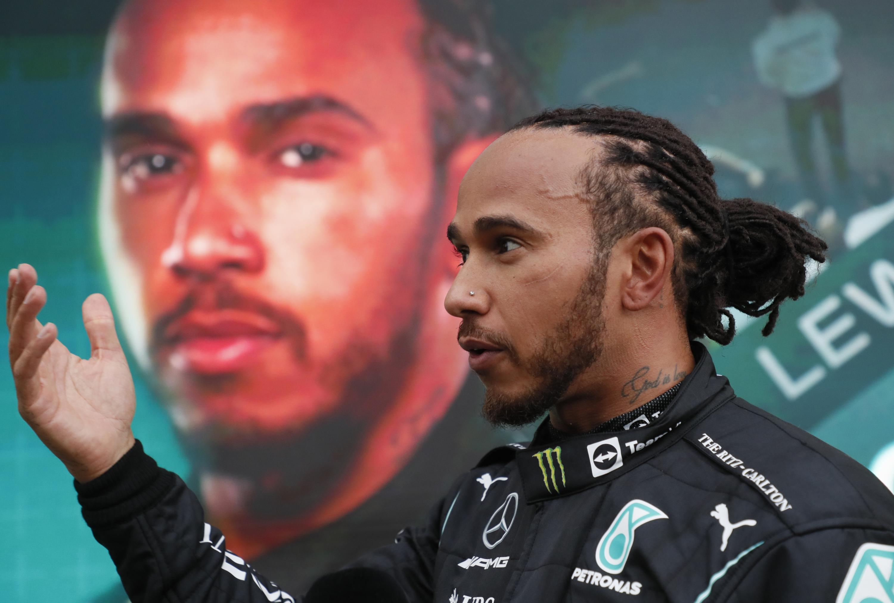 Hamilton wins 100th F1 race to take lead over Verstappen | AP News