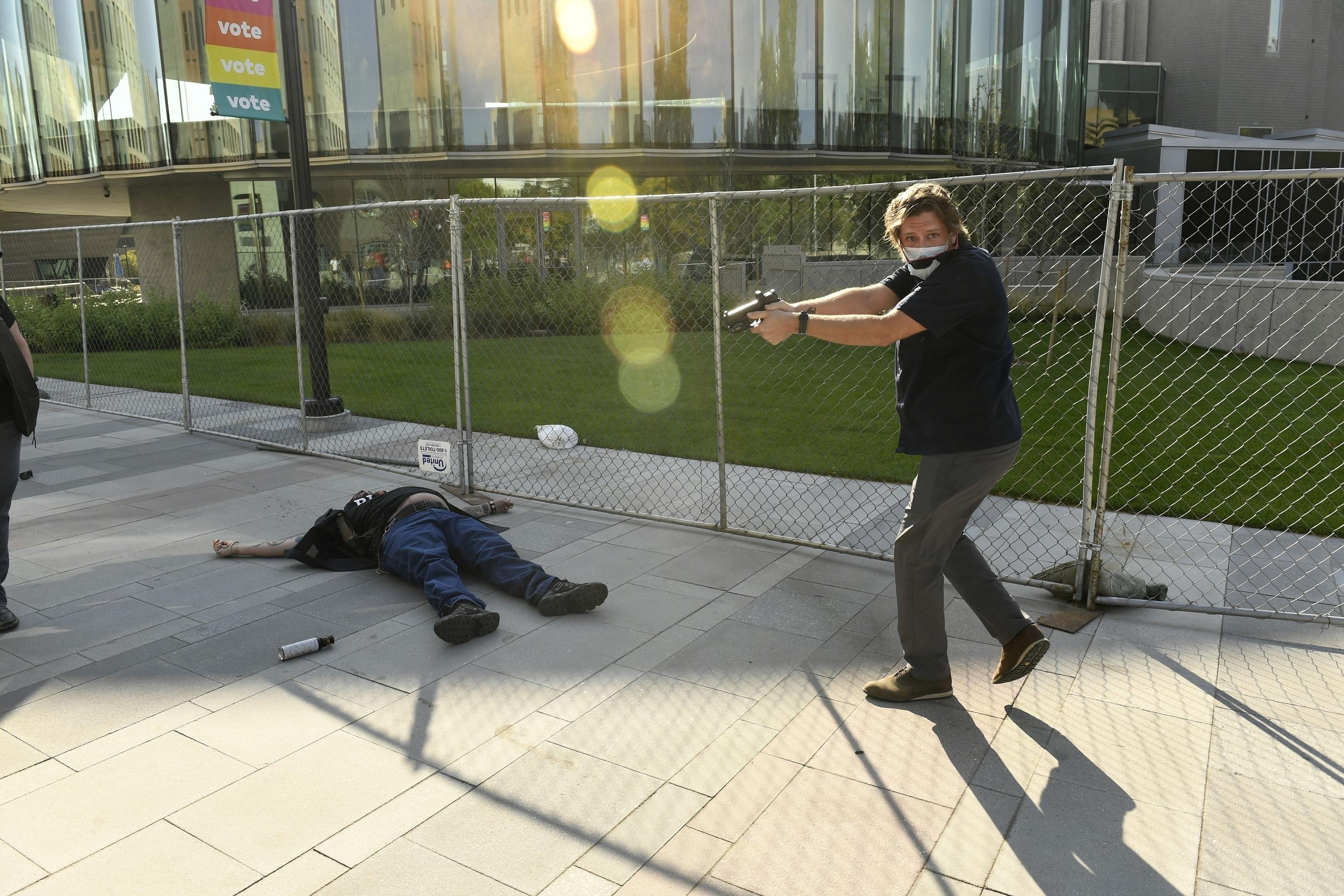 DA to drop murder charge against Denver TV station guard | AP News