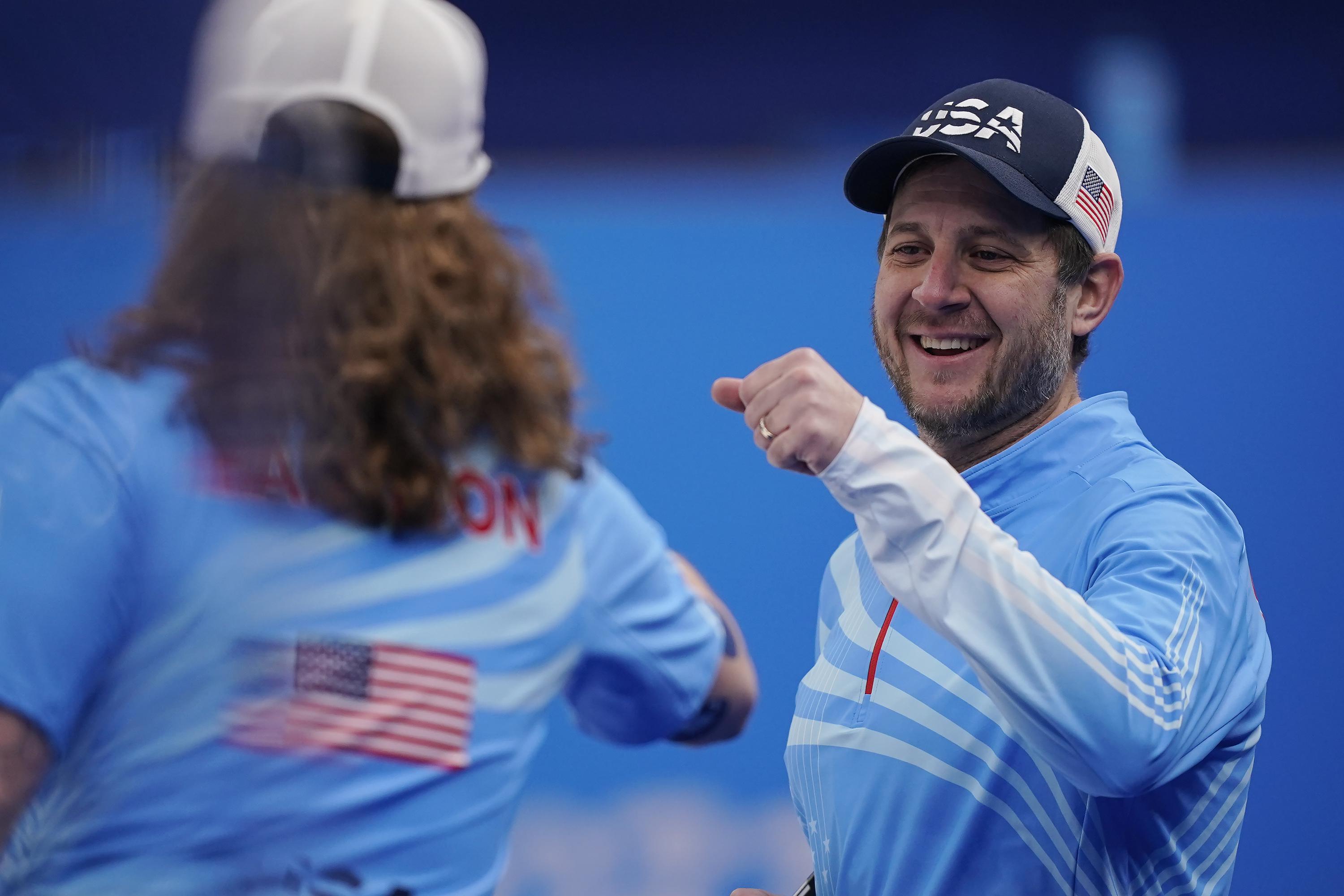 US men reach Olympic curling semis, keep repeat gold in play | AP News