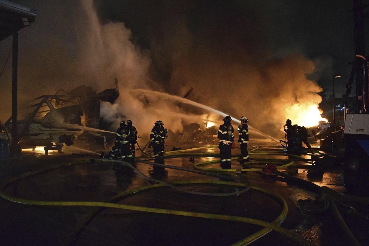 Fire at Seattle marina burns 30 boats on dry rack storage | AP News
