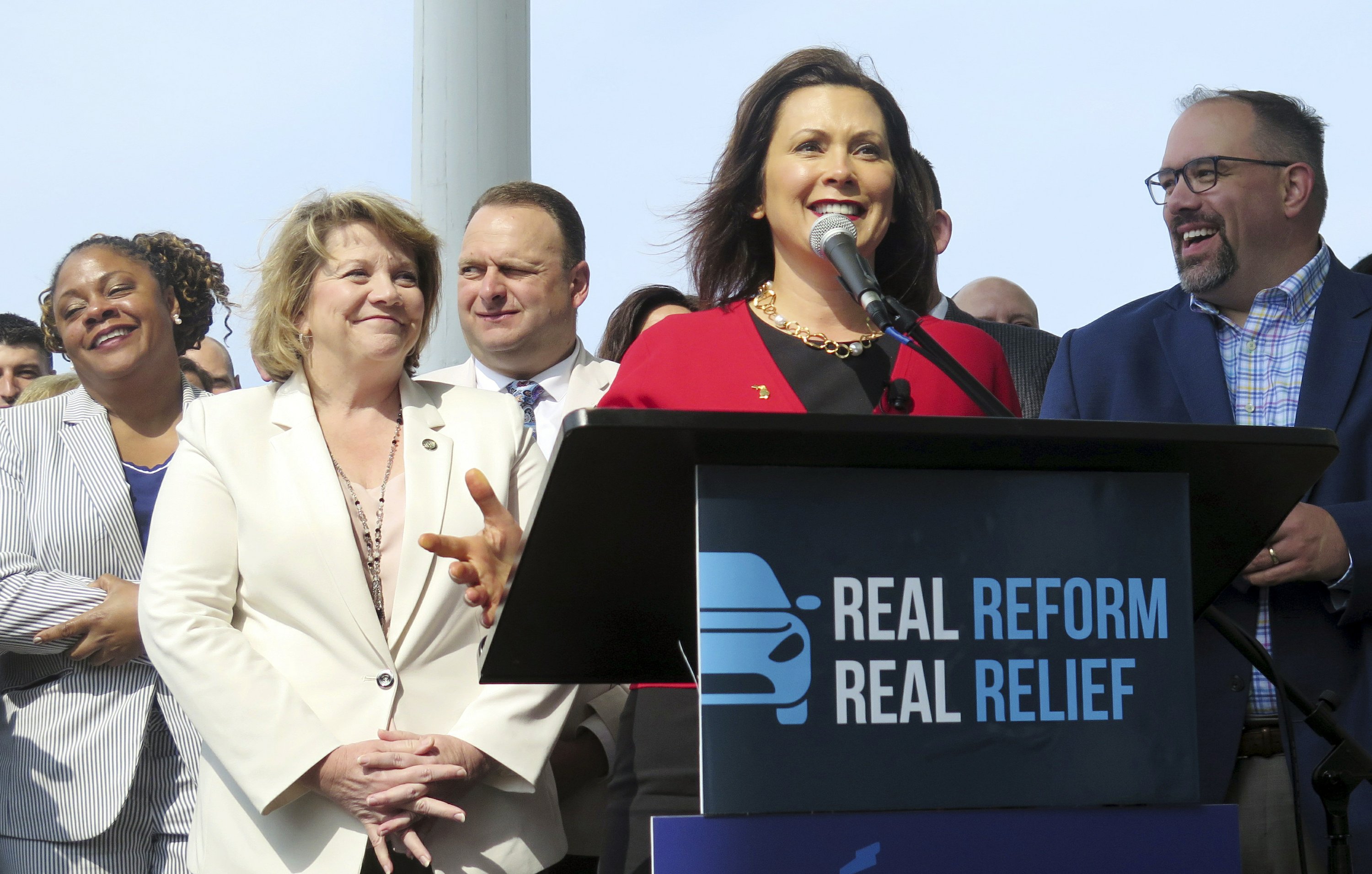 Whitmer on road fixes: No time to waste after insurance deal | AP News