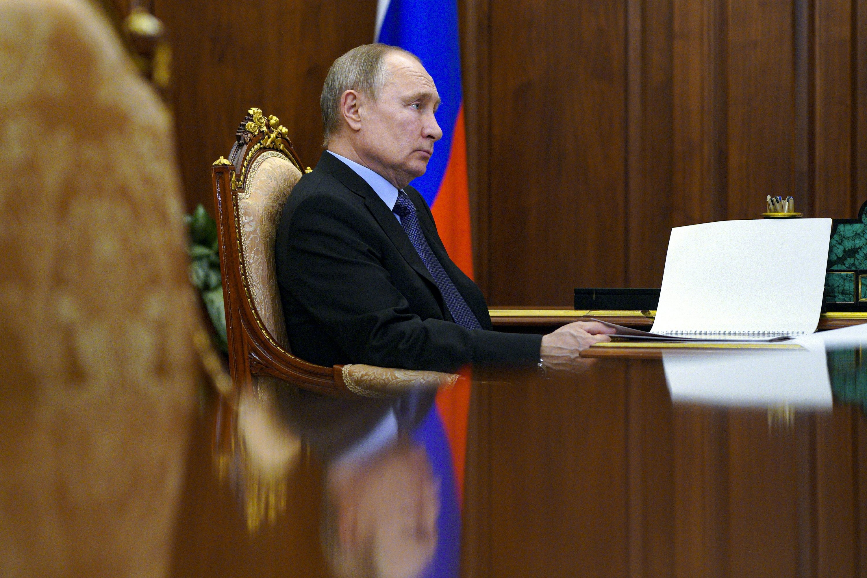 Putin signs law allowing him 2 more terms as Russia's leader