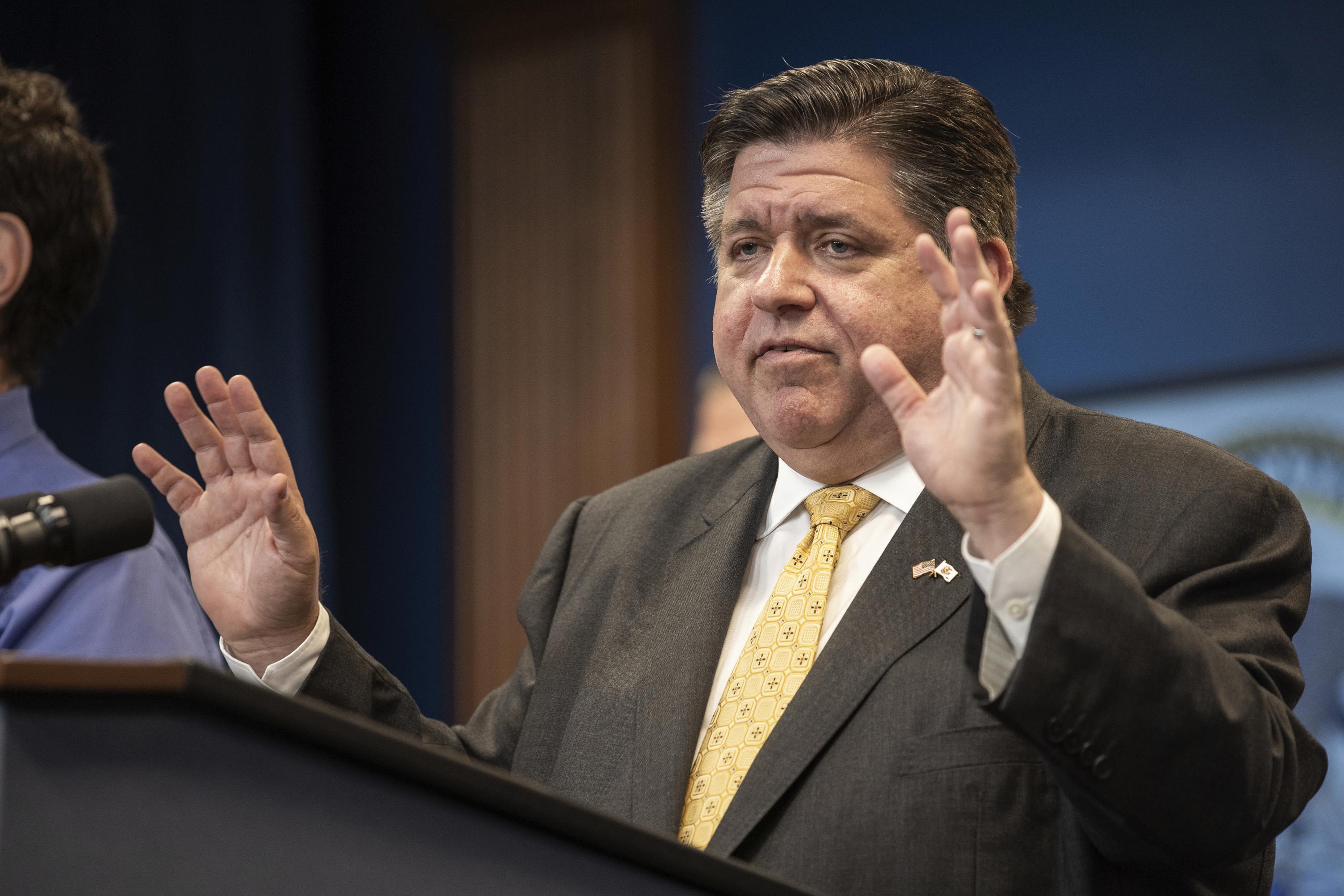 Pritzker calls up Guard to help care for arriving migrants | AP News