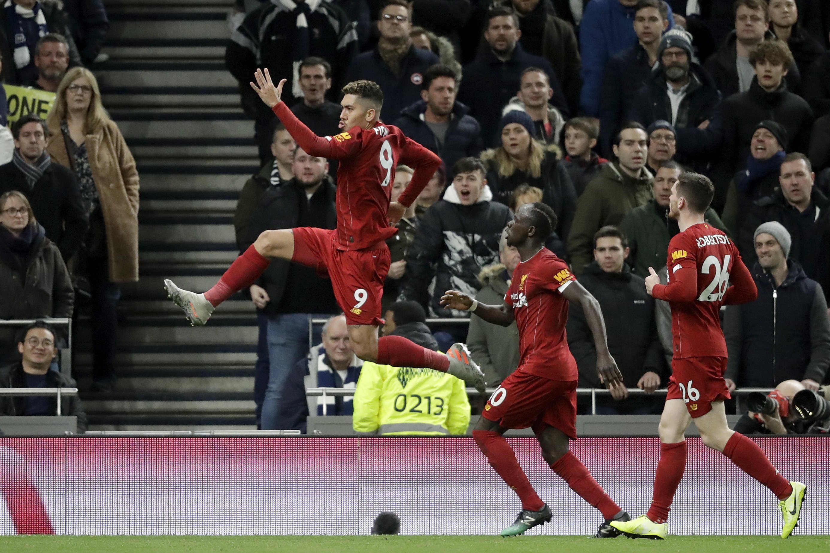 Liverpool extends EPL lead to 16 points by beating Spurs | AP News