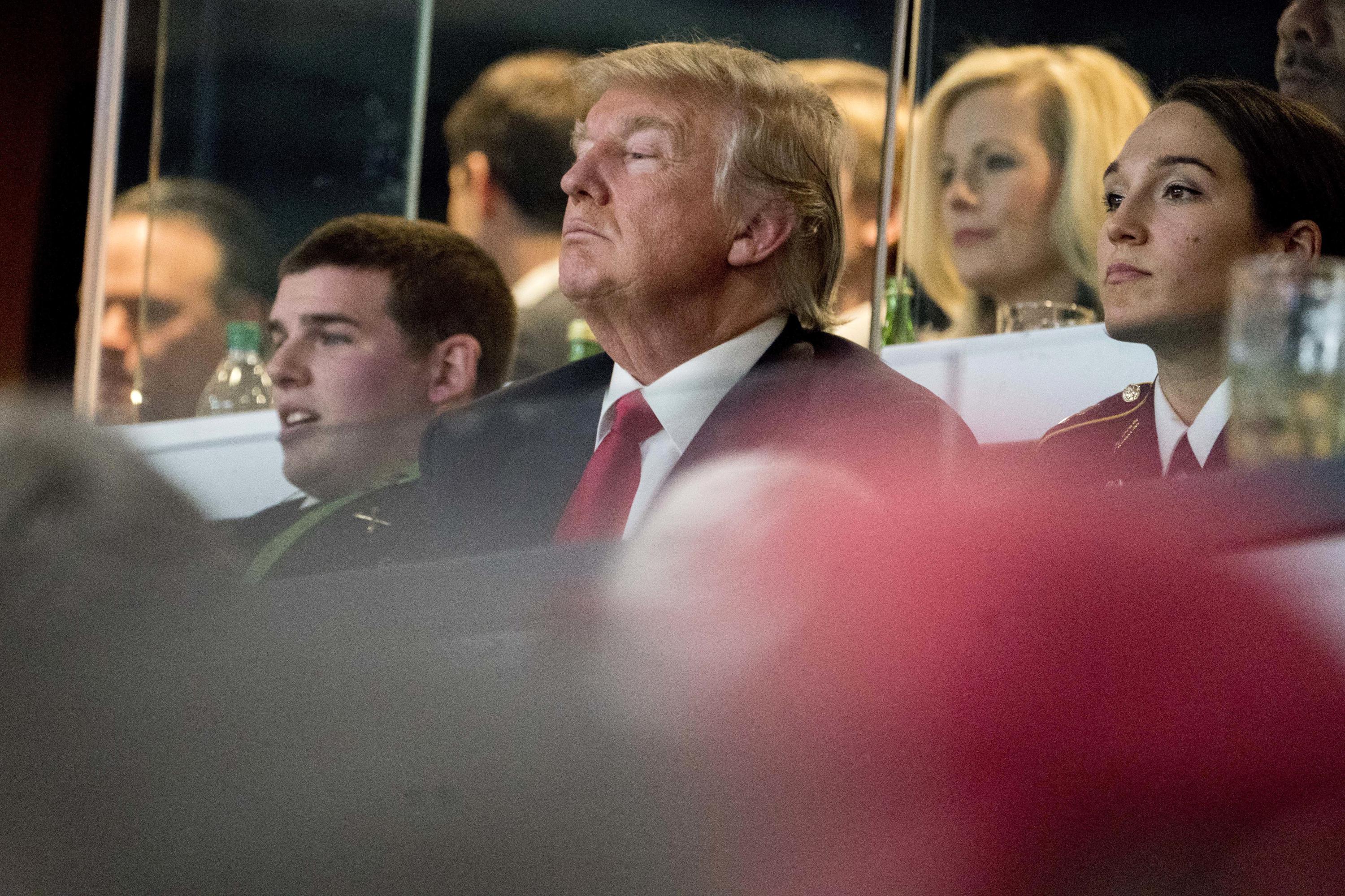 Trump gets a national anthem moment at football title game | AP News