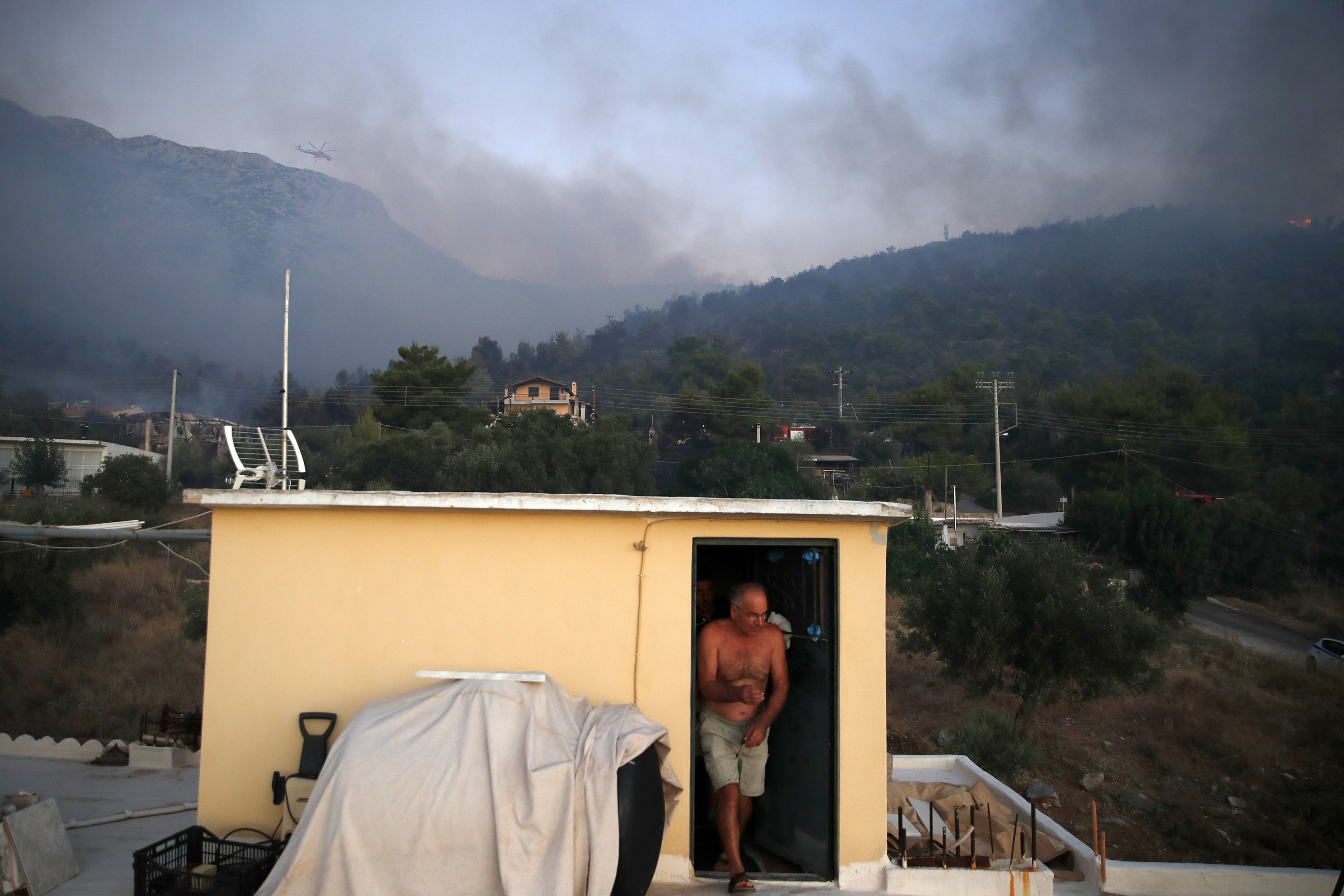 Fire east of Athens under control; some homes damaged | AP News