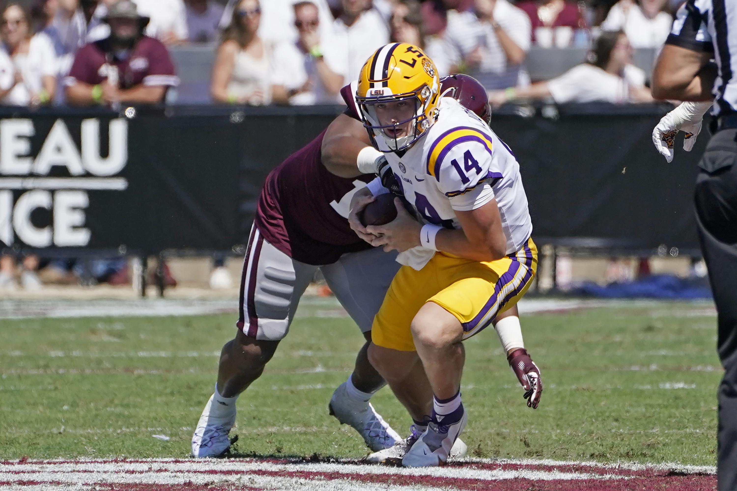 Johnson has 4 TD passes, LSU outlasts Mississippi St. 28-25 | AP News