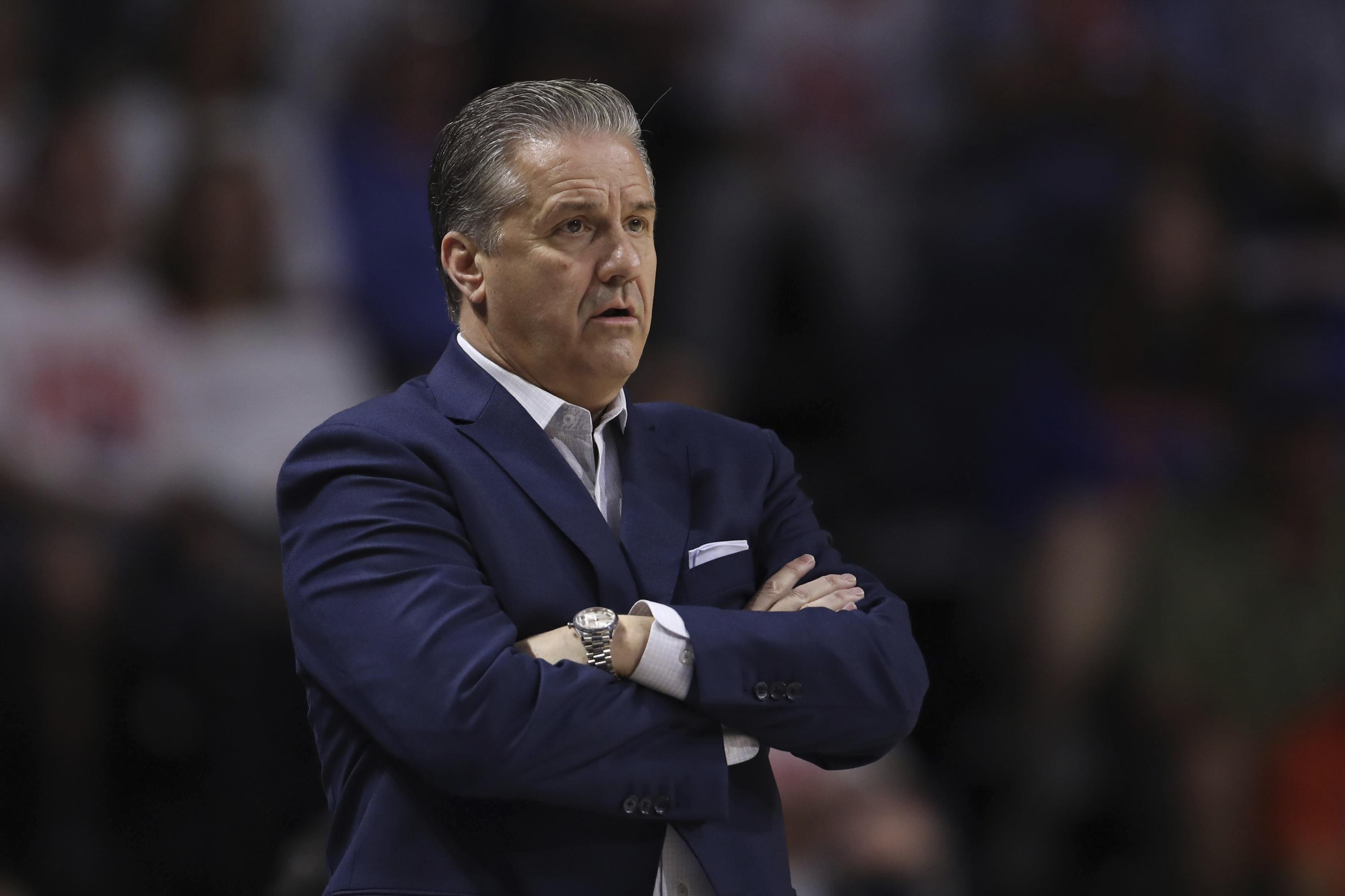 Woman arrested outside Kentucky coach John Calipari's home | AP News