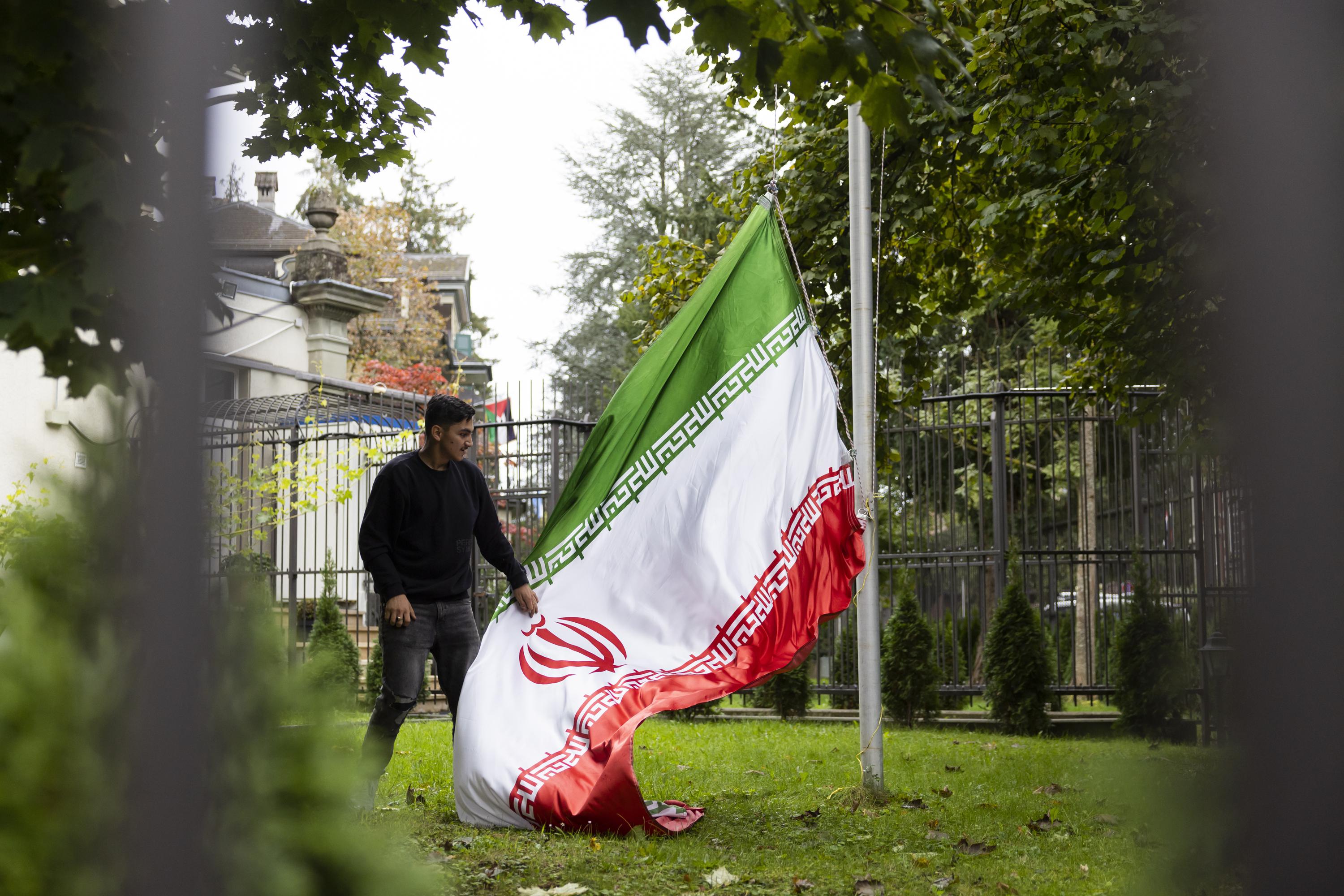 Swiss police violently disperse anti-Iran protest at embassy | AP News