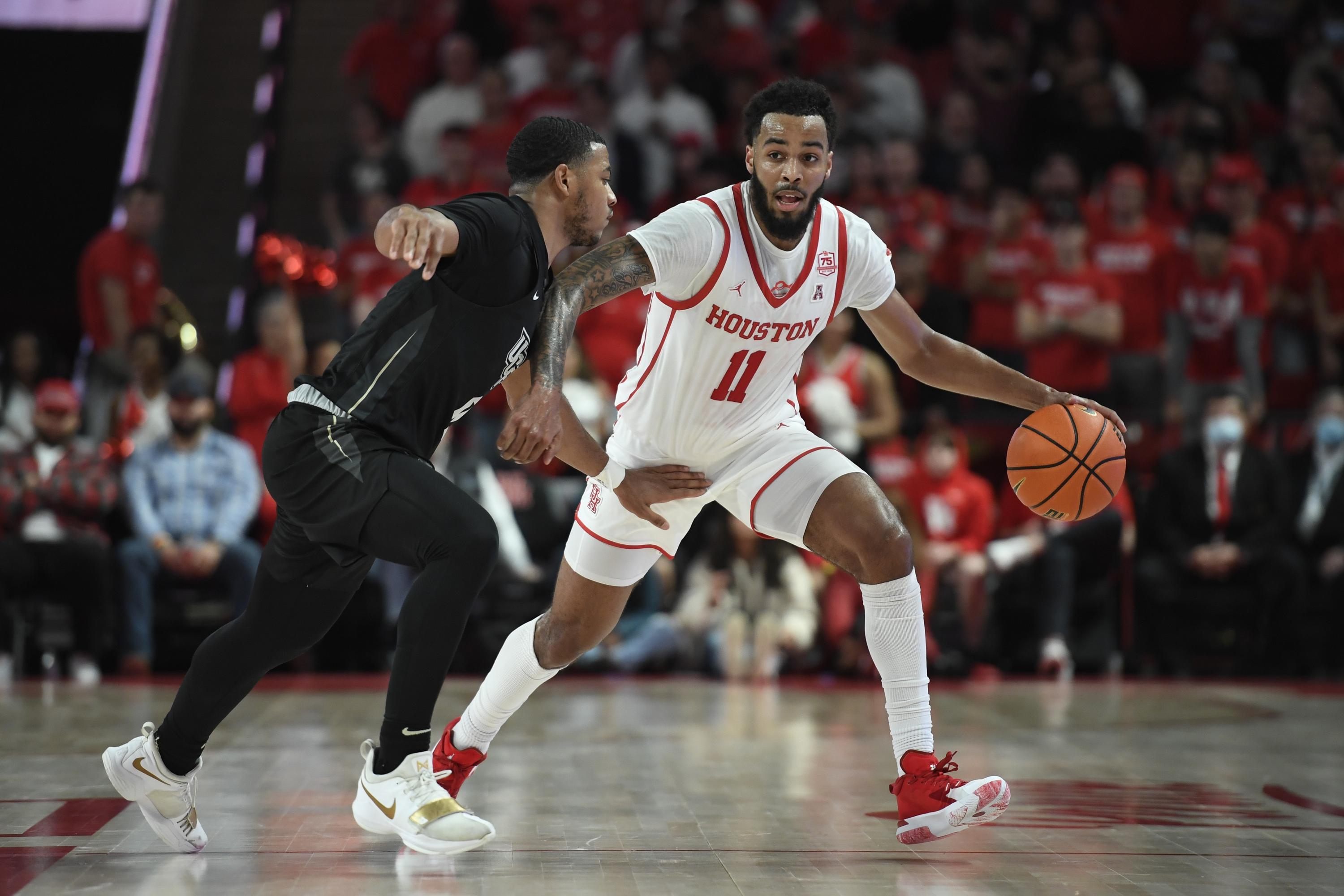 No. 14 Houston bounces back from 2 losses, beats UCF 70-52 | AP News