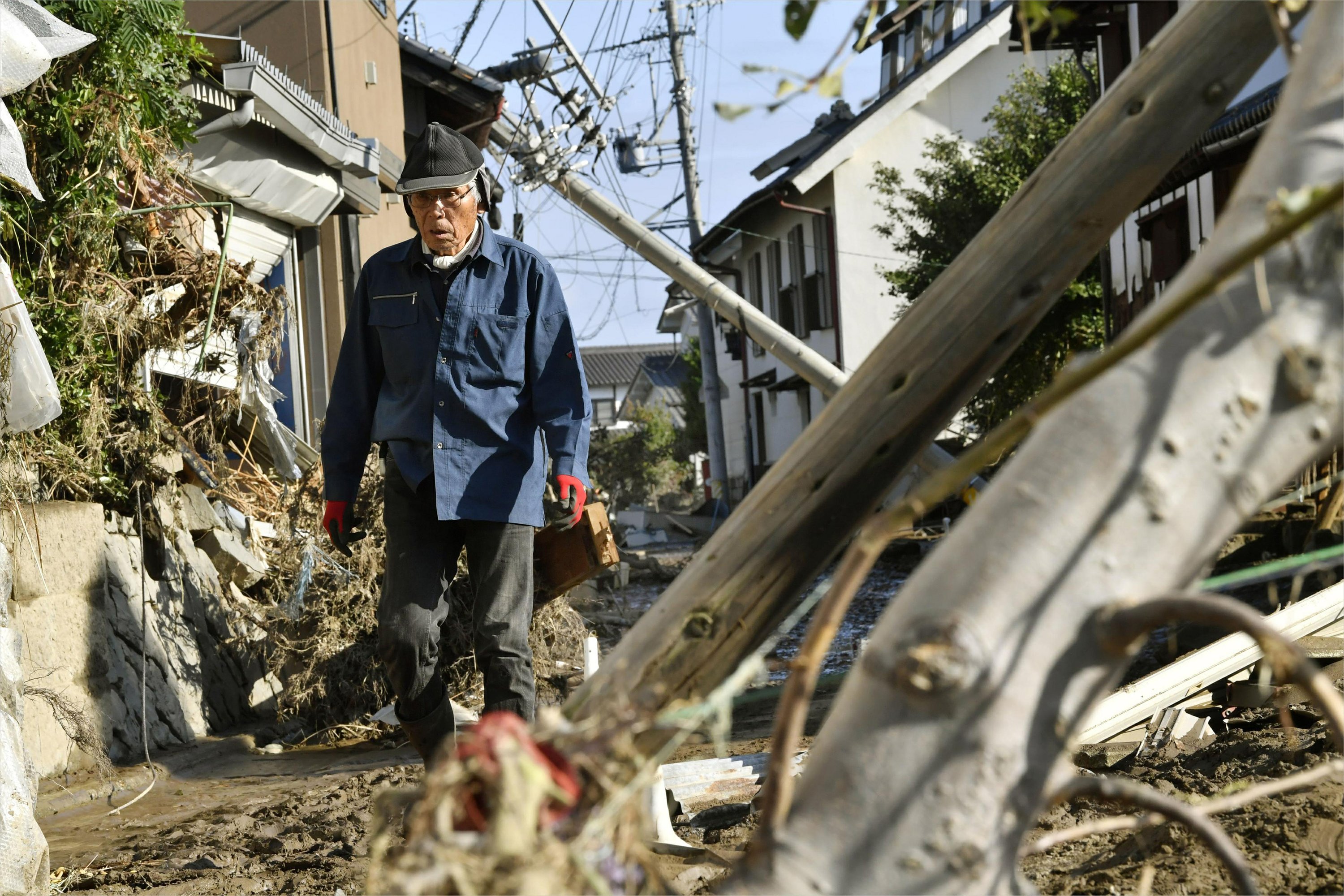 Japan typhoon death toll climbs, while floodwaters recede | AP News