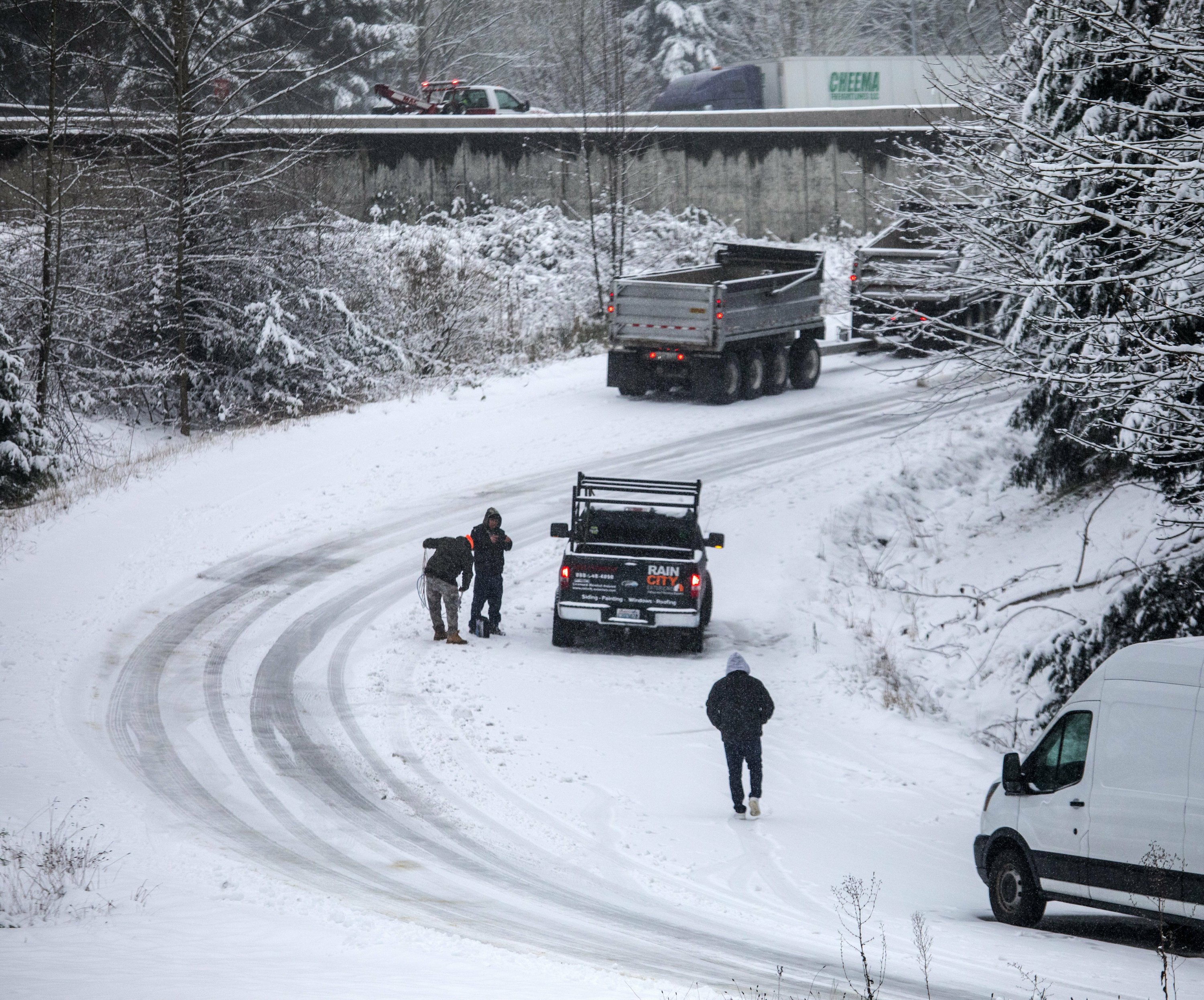 Snow causes more school, road closures in Northwest | AP News
