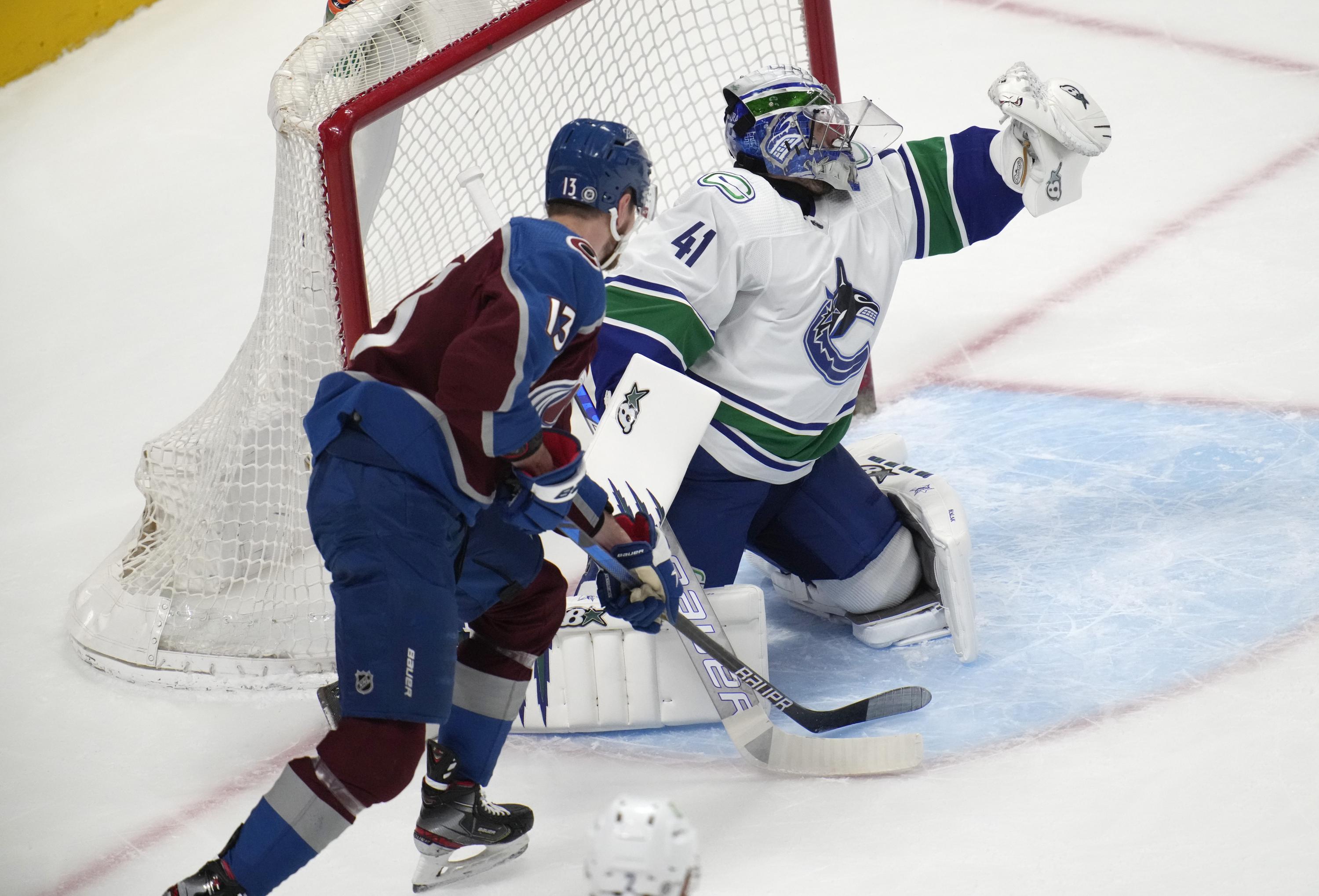 Halak, Canucks contain high-flying Avalanche in 3-1 win | AP News