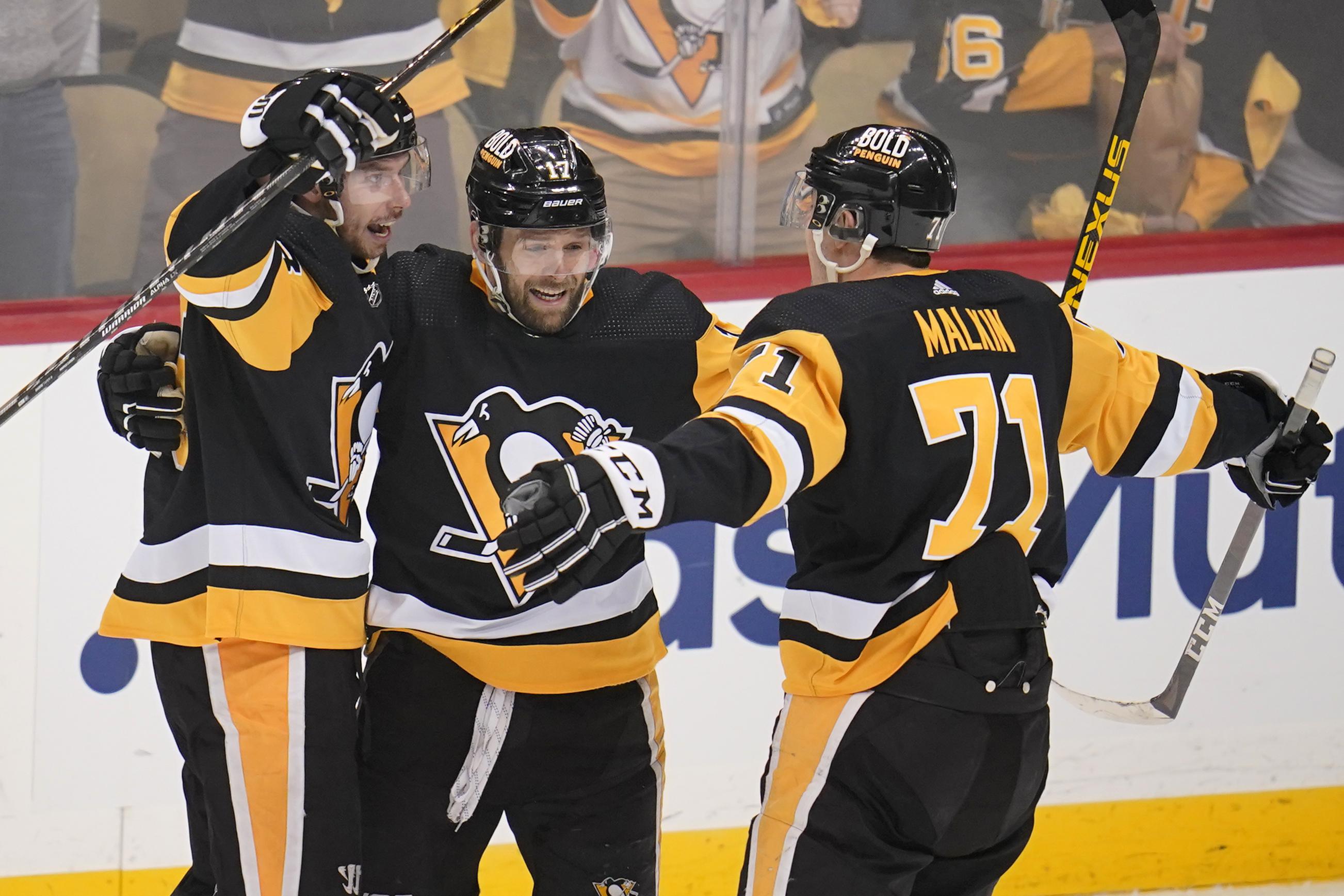 Penguins F Bryan Rust fine with taking a discount to stay | AP News