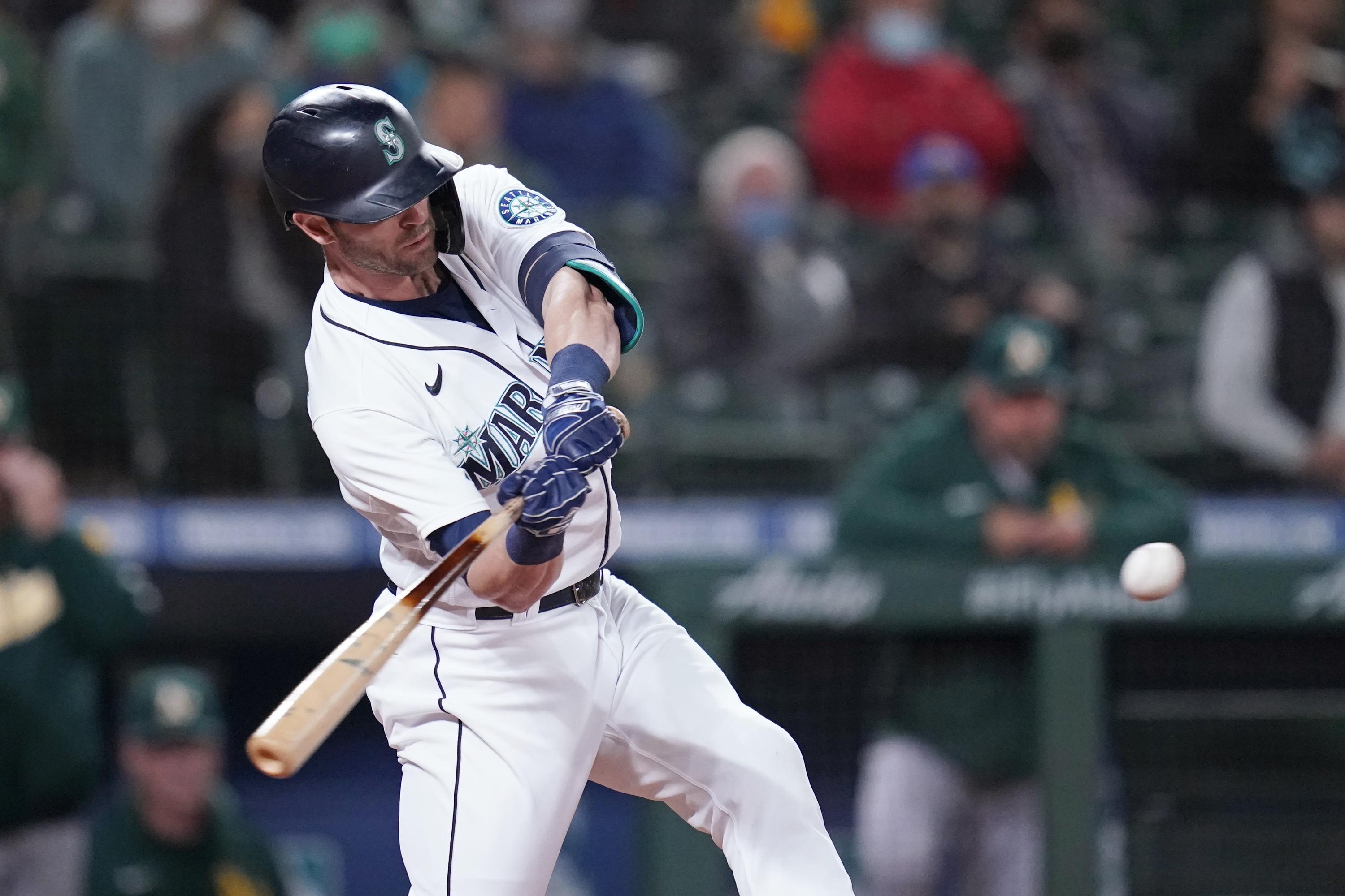 Haniger hits 2 HRs, M's beat A's to gain in wild-card race | AP News