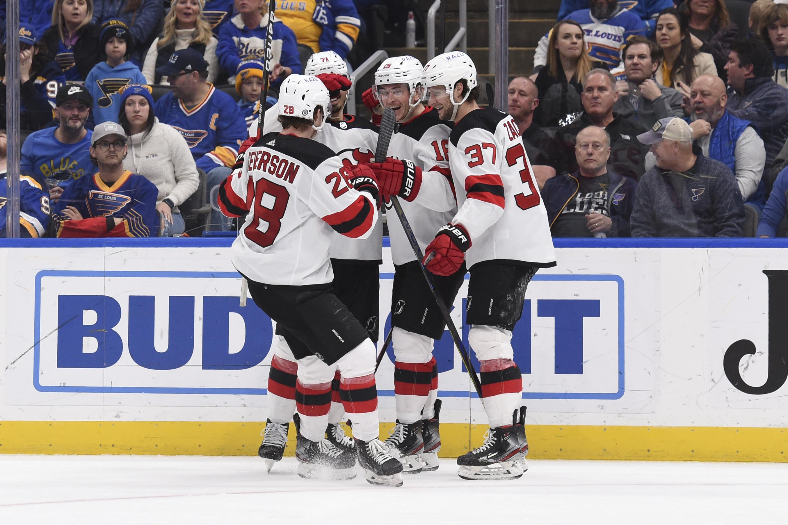 Devils score 5 goals in 3rd period to beat Blues 7-4 | AP News