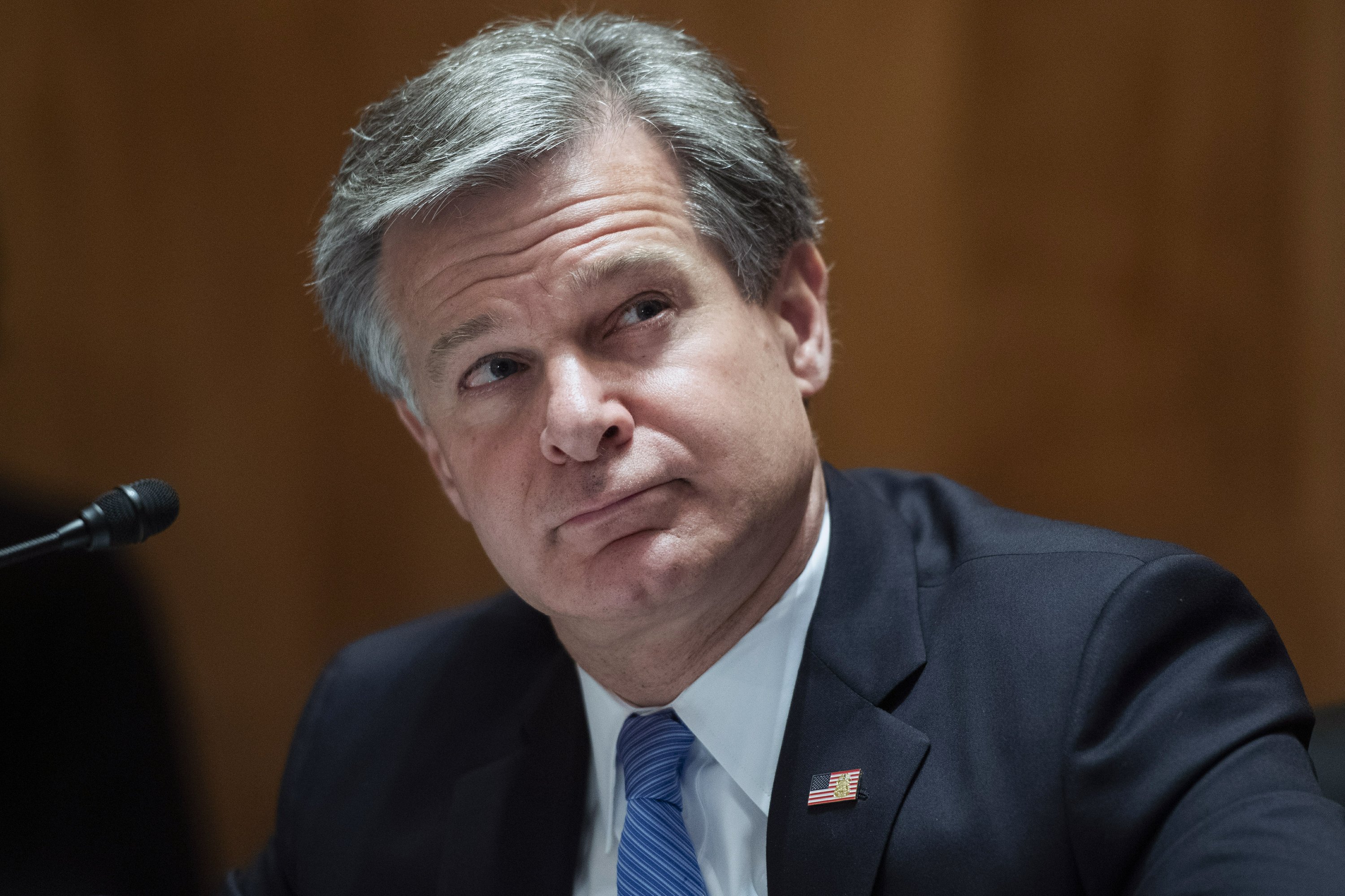 Job on the line, Wray threads needle on controversial issues | AP News