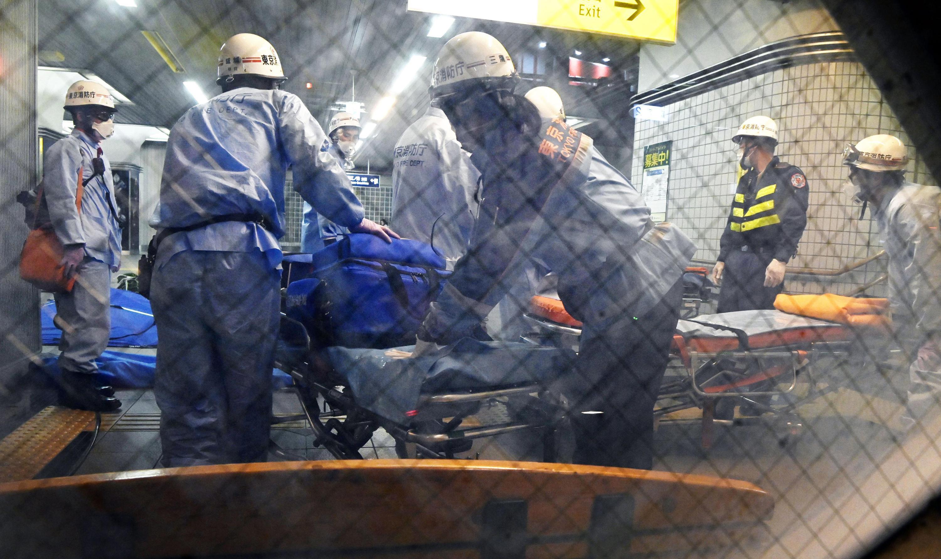 Man arrested after injuring 10 with knife on Tokyo train | AP News