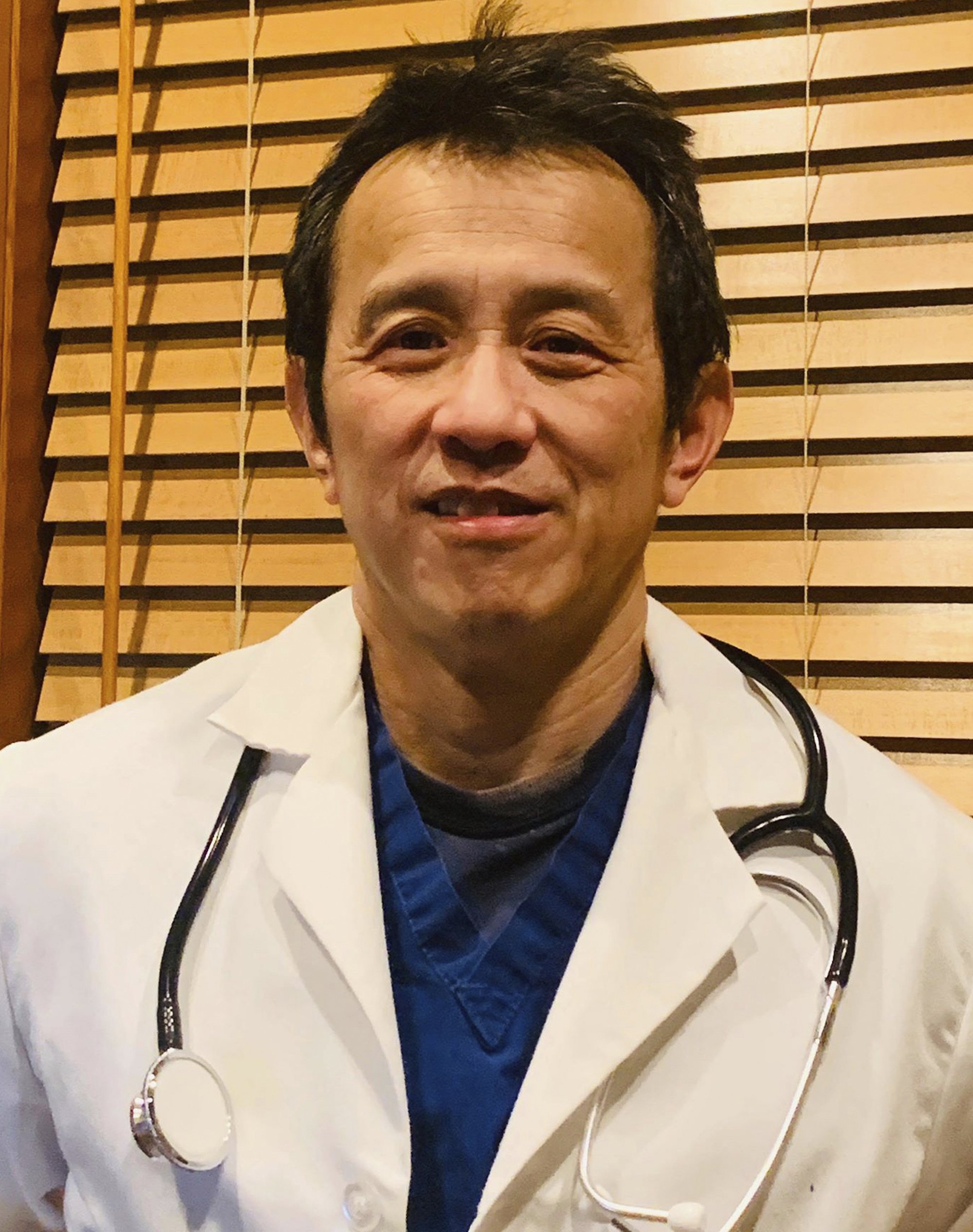 Doctor fired after blasting COVID preparations sues hospital | AP News