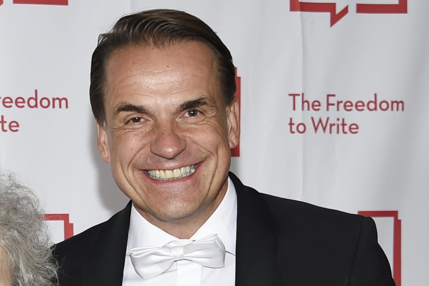 CEO of publishing giant defends deal challenged by US gov't | AP News