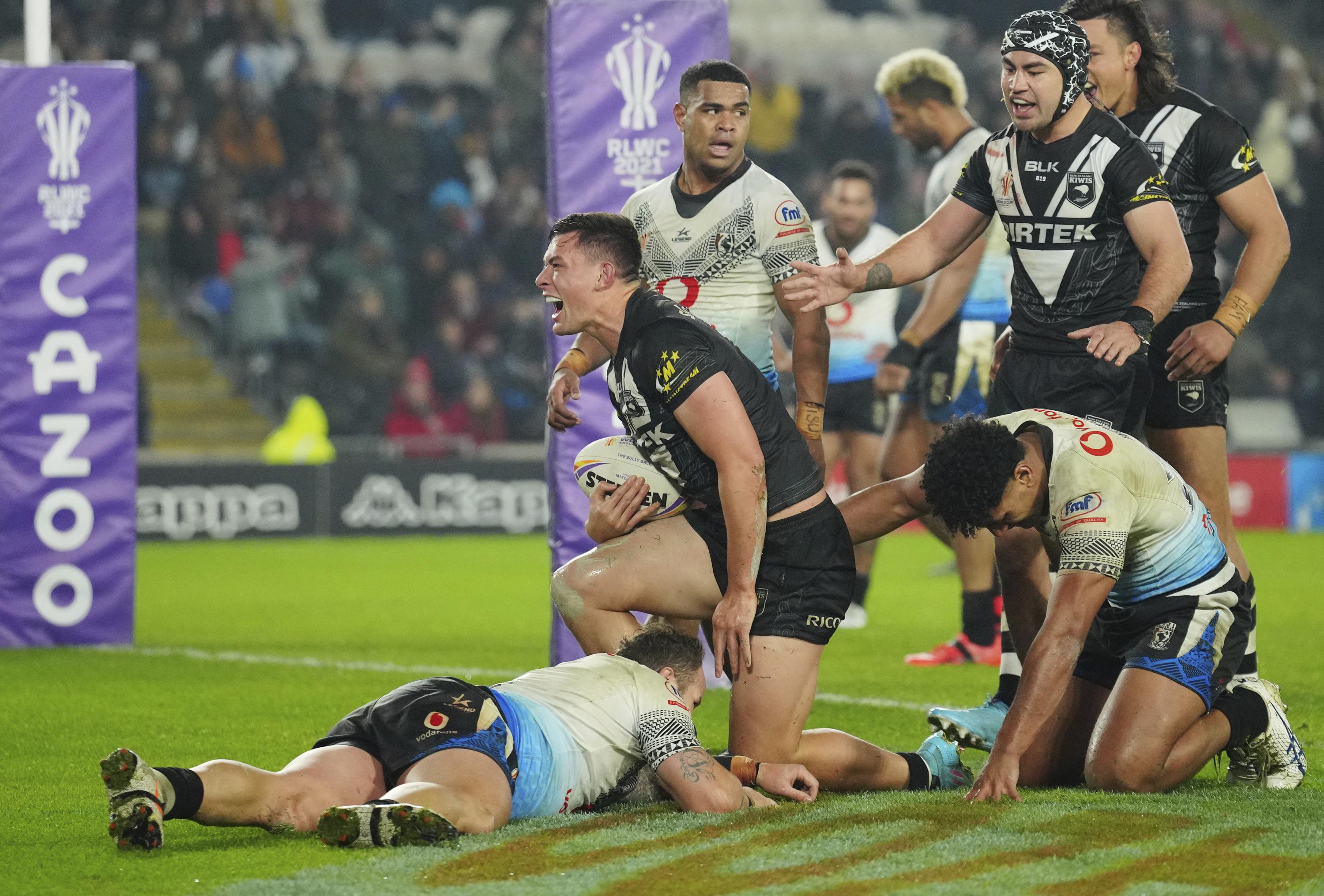 NZ survives Fiji scare to confirm semis clash with Australia | AP News