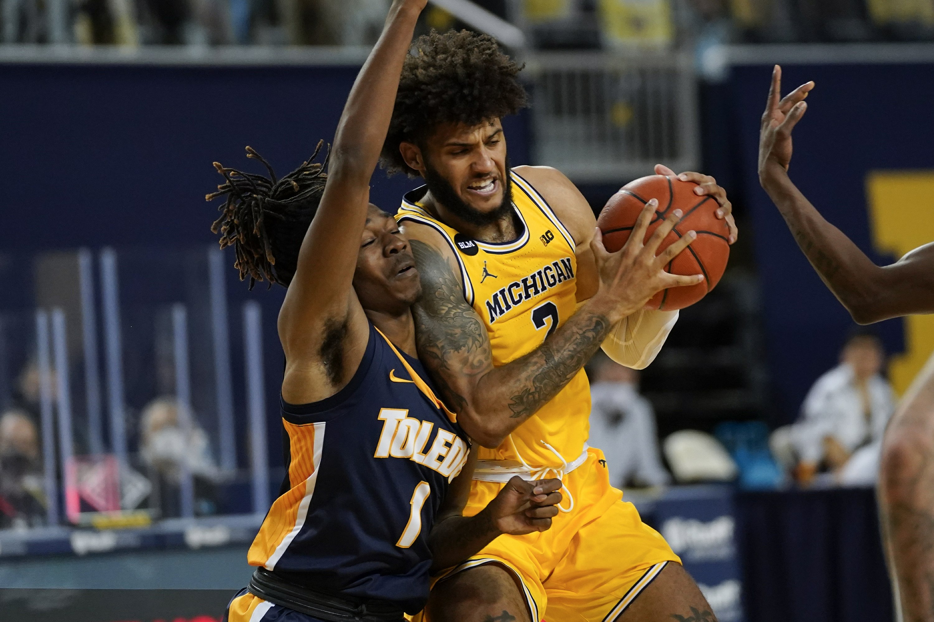 Dickinson's 18 leads Michigan past Toledo 91-71 | AP News