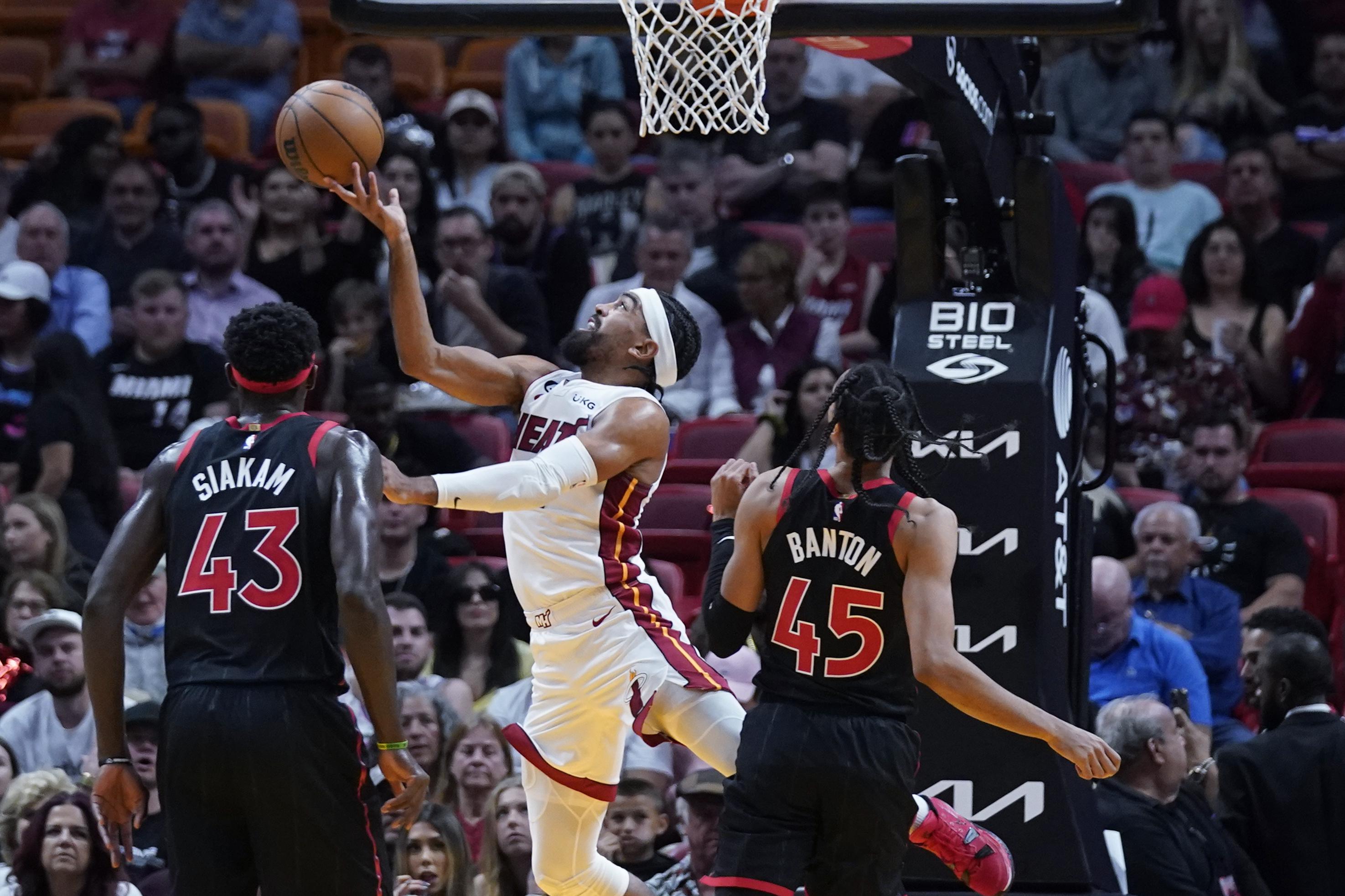 Raptors clamp down on Miami, top Heat 98-90 for split | AP News