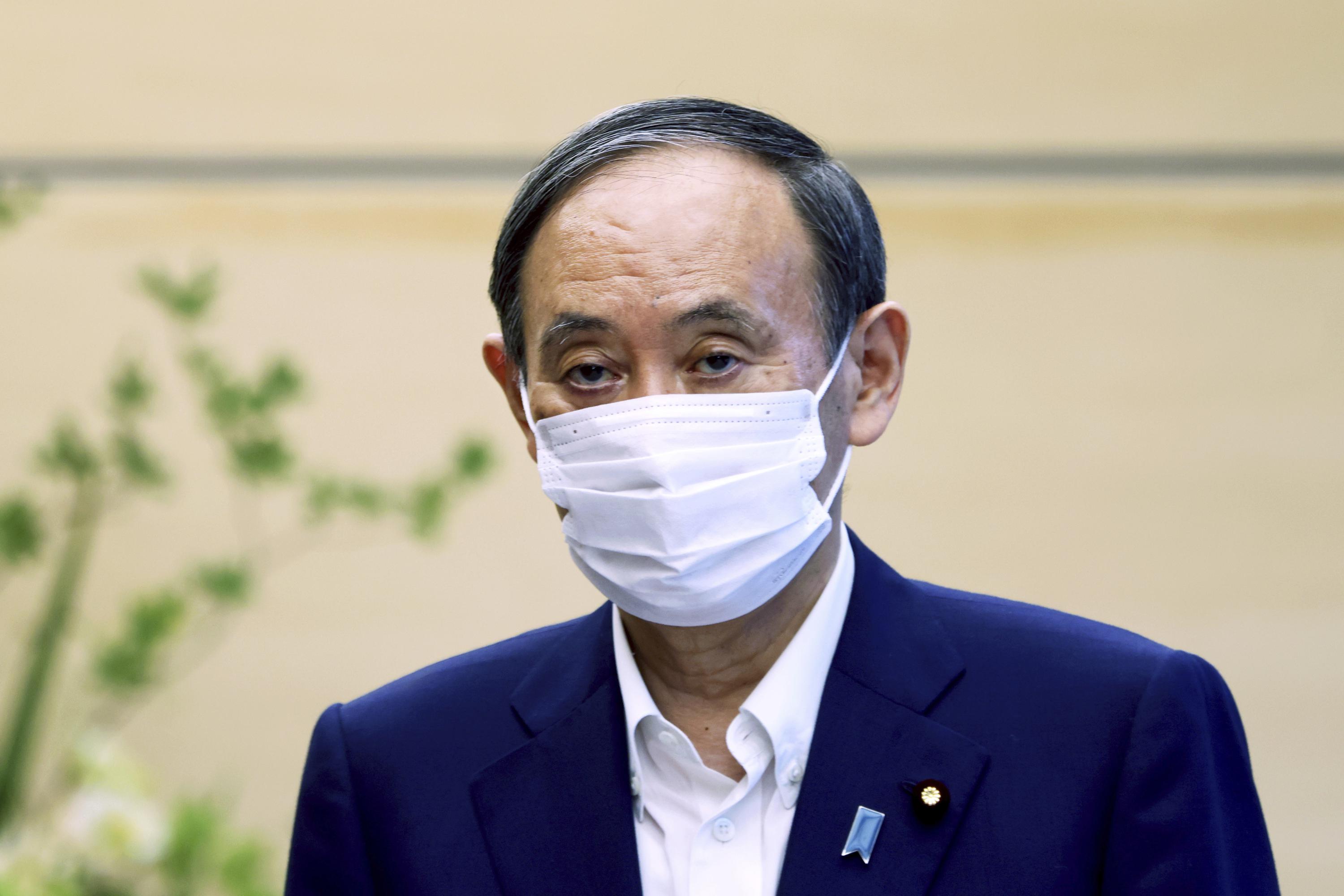 Suga bows out of party vote, paves way for new Japan leader | AP News