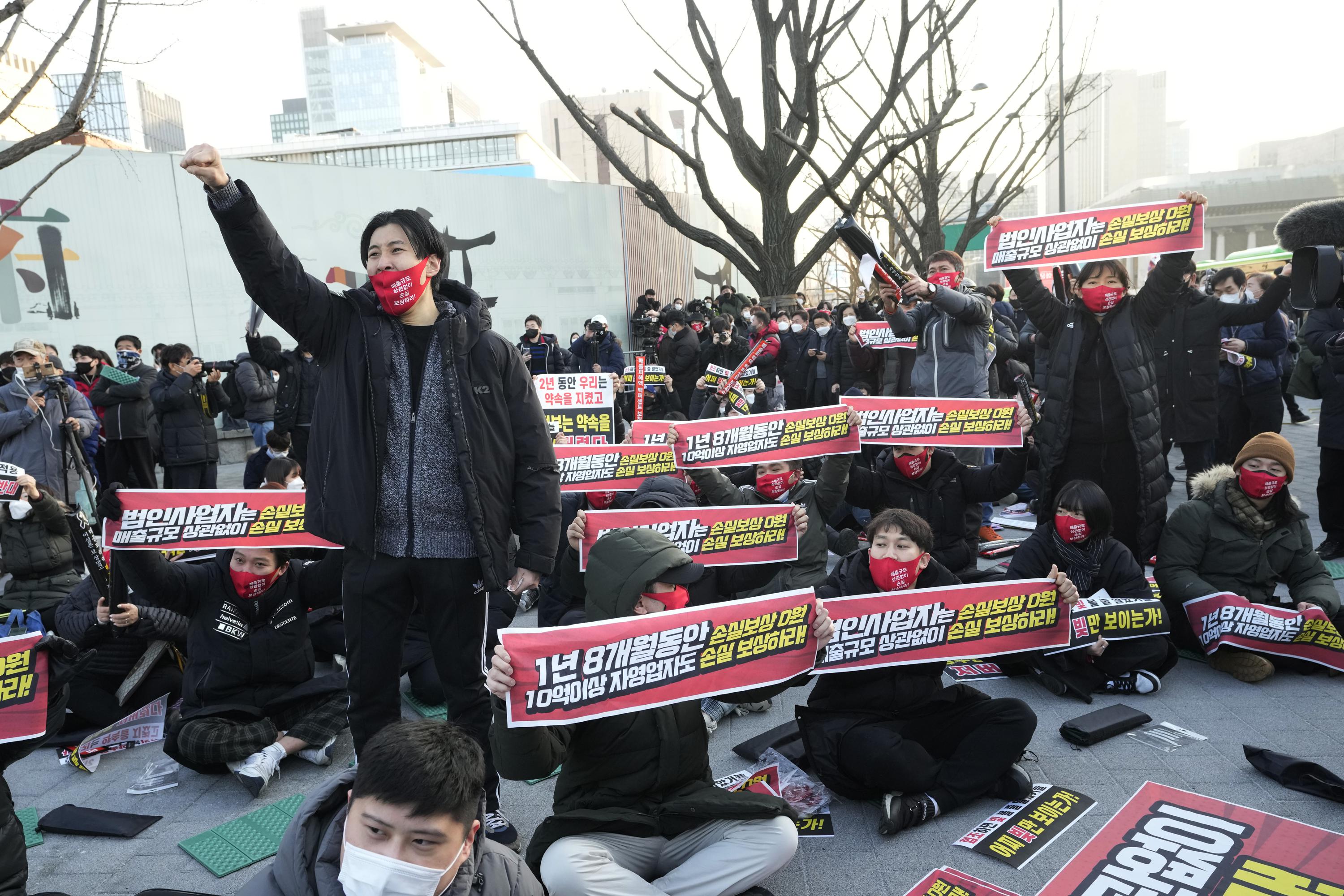 Small business owners rally in Seoul to protest virus curbs | AP News