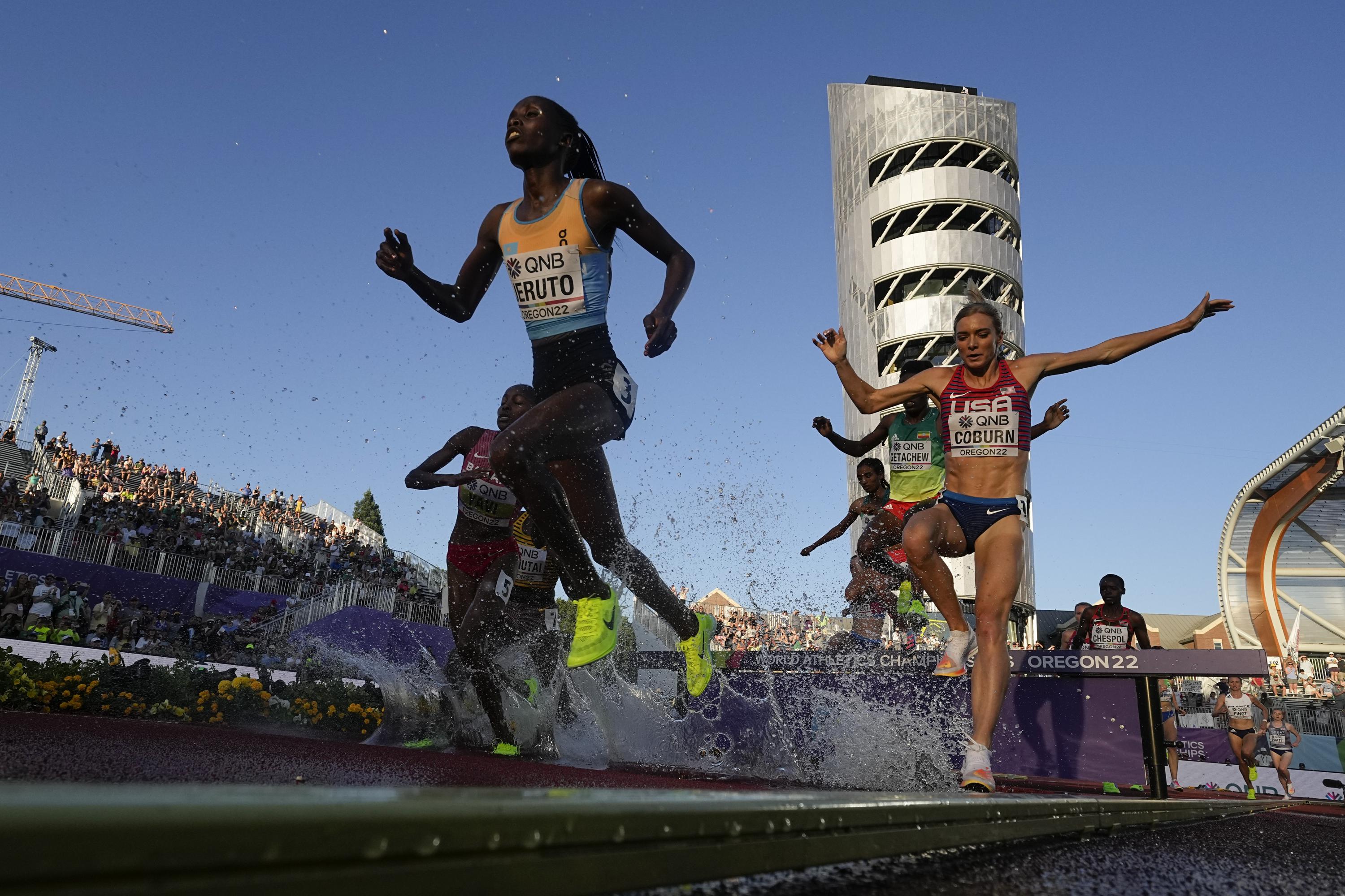 Steeplechaser Jeruto plunges into water after gold at worlds | AP News