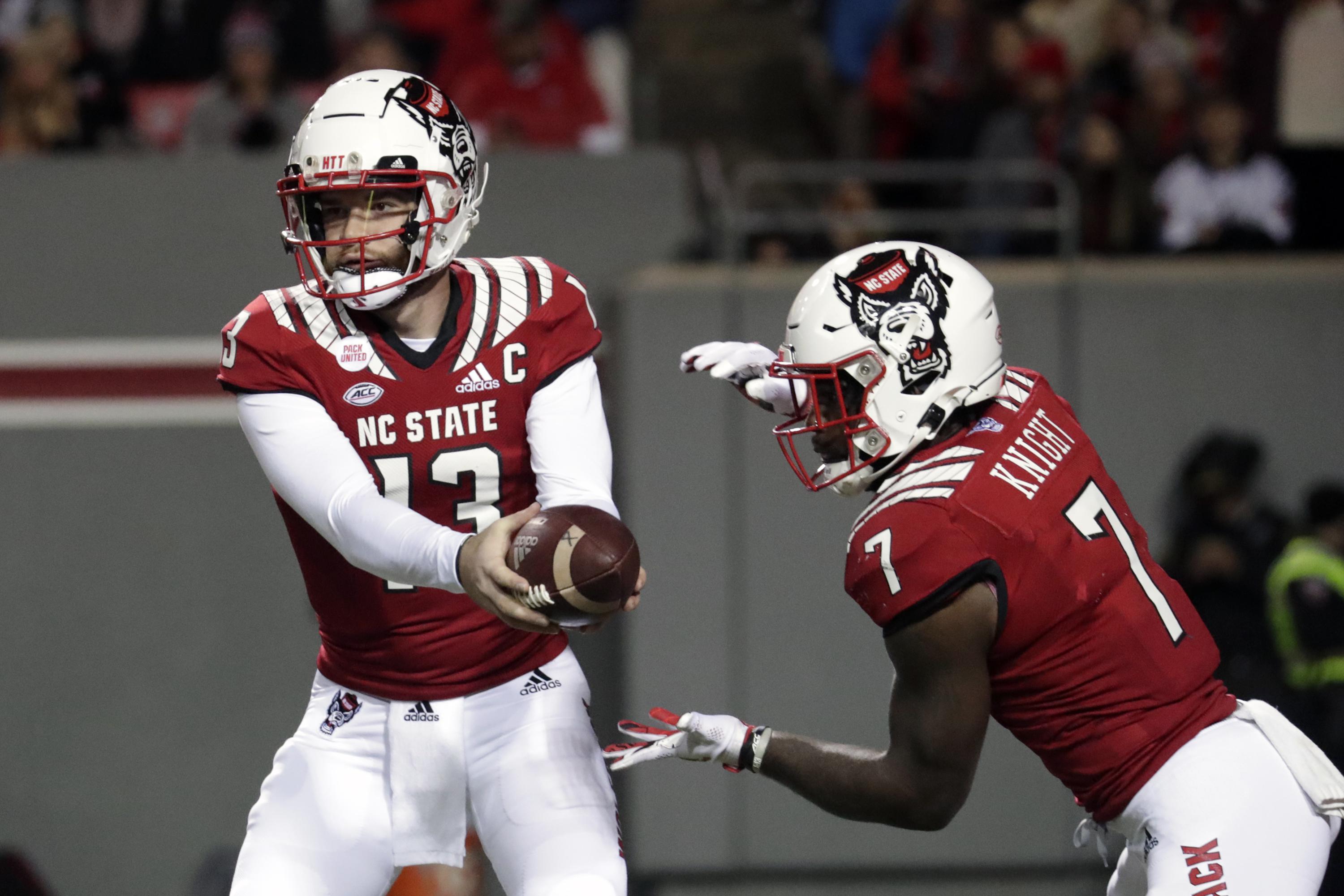 No. 24 NC State stuns NC 34-30 with 2 TDs in 26 seconds | AP News