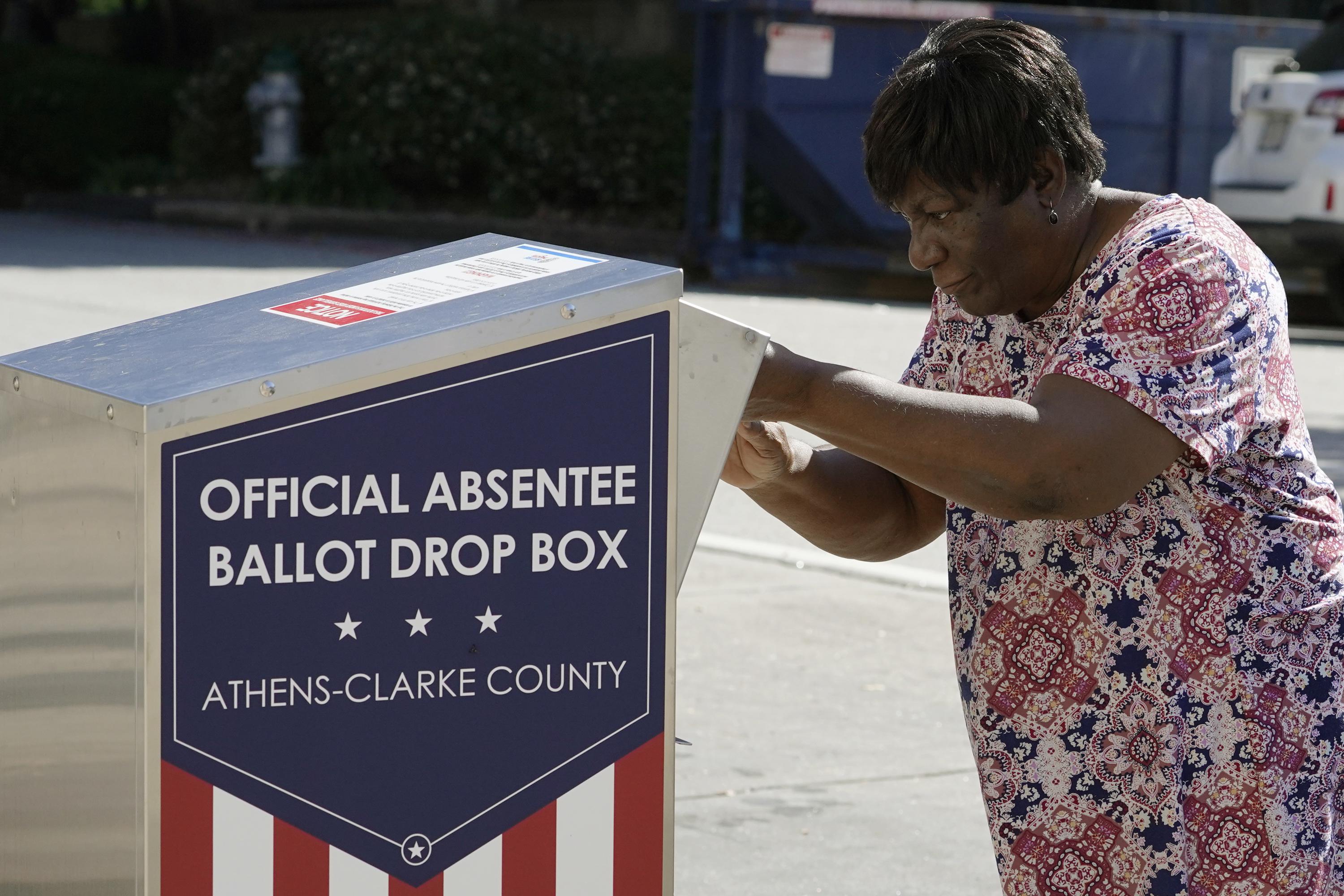 Report shows big spike in mail ballots during 2020 election | AP News