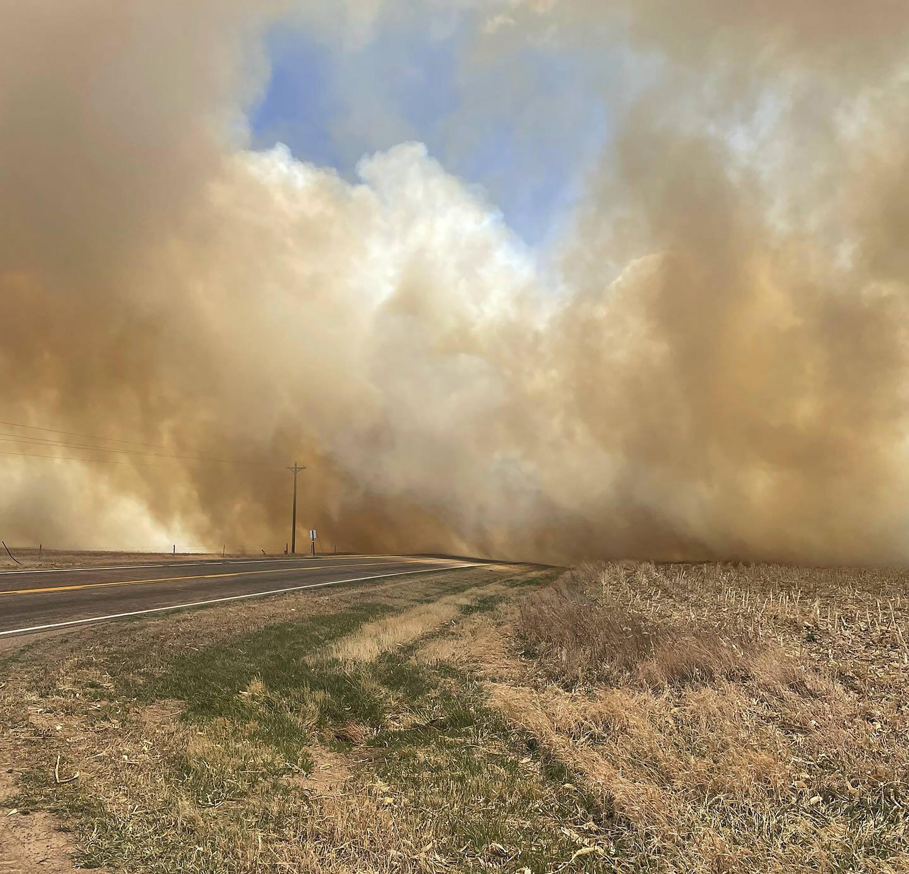 Wildfires tear across several states, driven by high winds | AP News