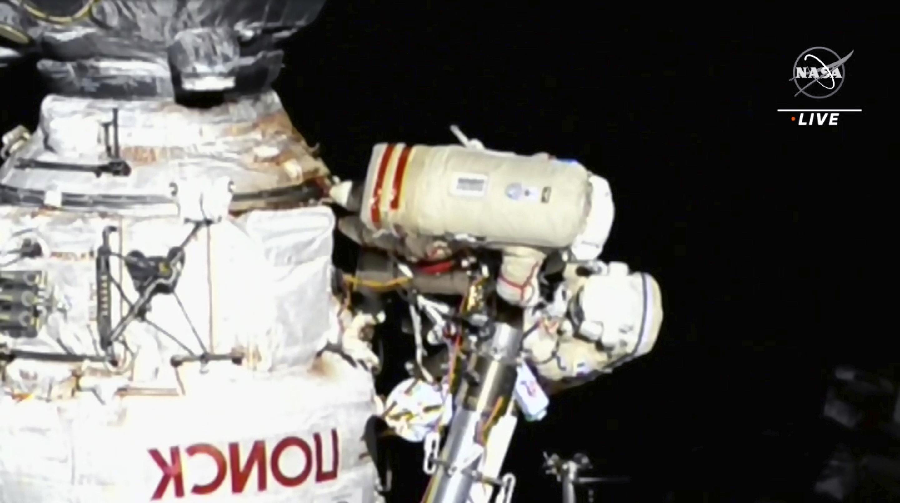 Italian, Russian share rare spacewalk amid Ukraine tensions | AP News