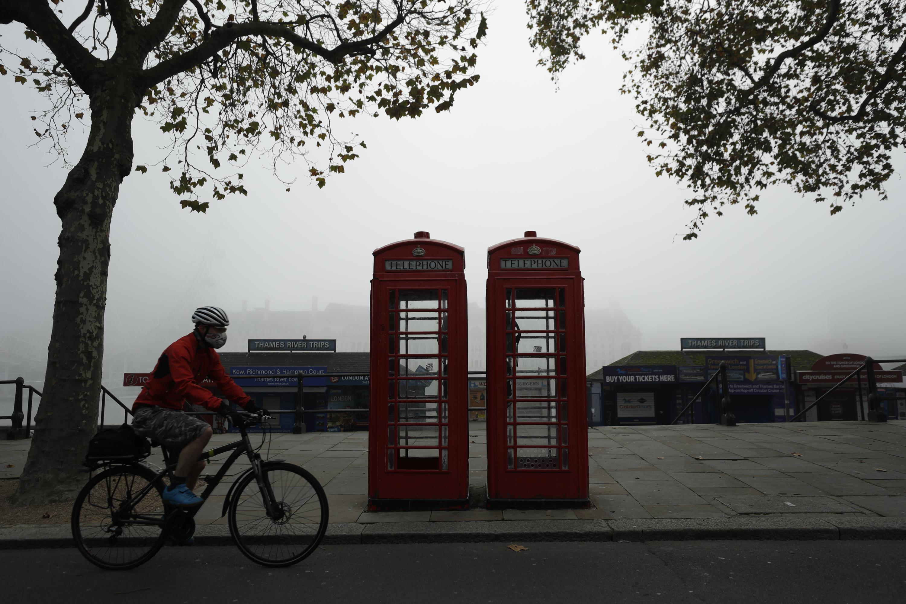 Thousands of red UK phone boxes to be protected from closure | AP News