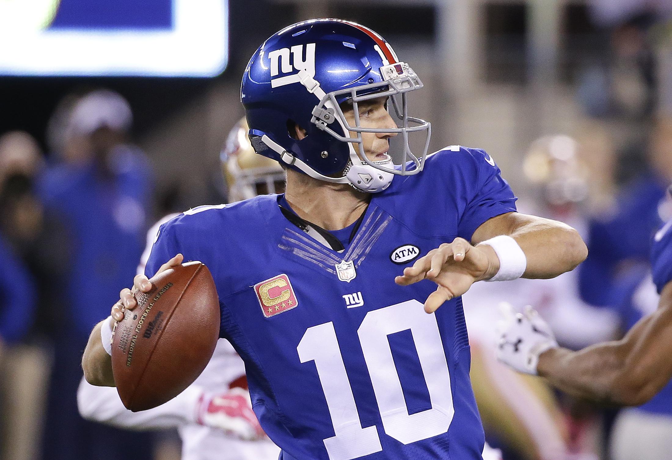 Eli Manning has come long way since rough debut in Philly | AP News