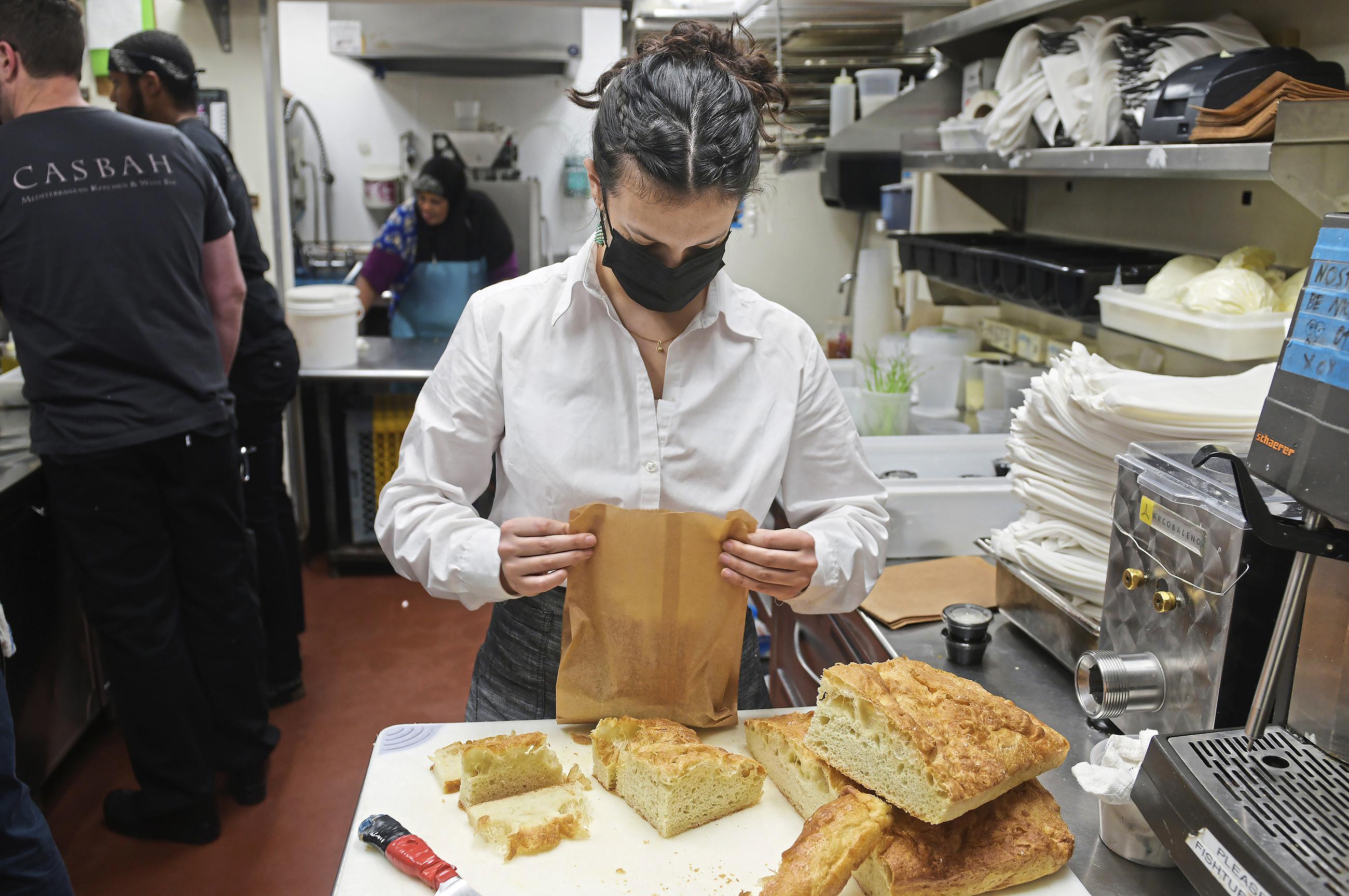 US service industry grows more slowly in December | AP News