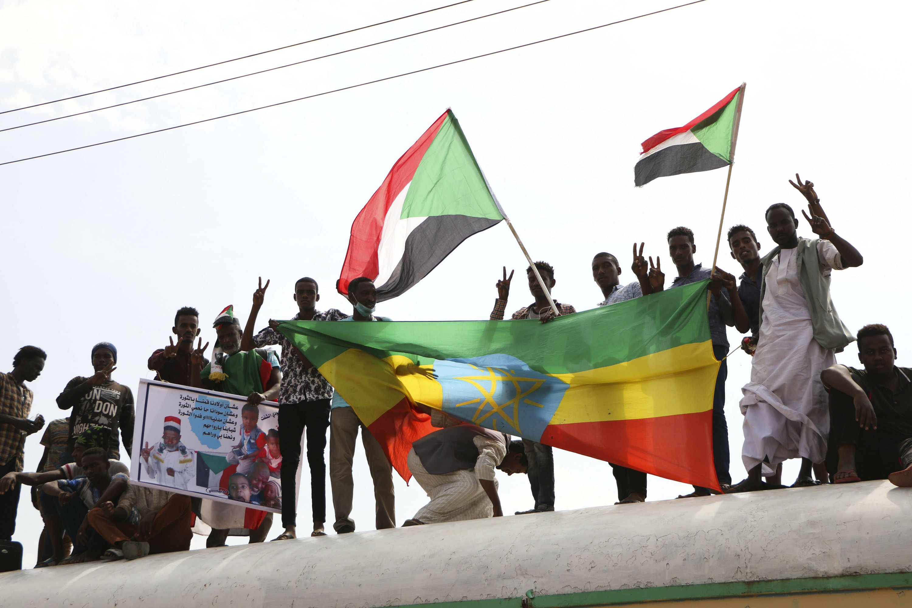 Sudan protesters, army announce new ruling body after deal | AP News