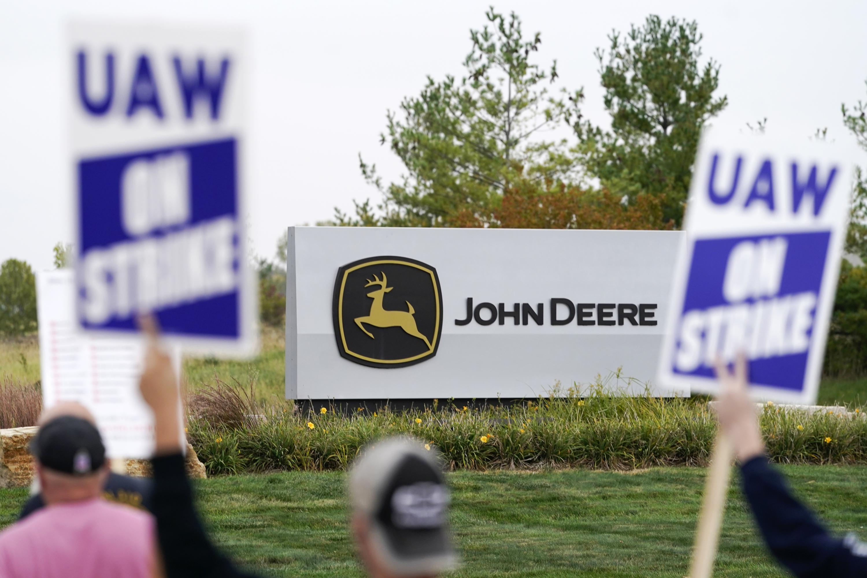 Deere workers would get immediate 10% raises under new offer | AP News