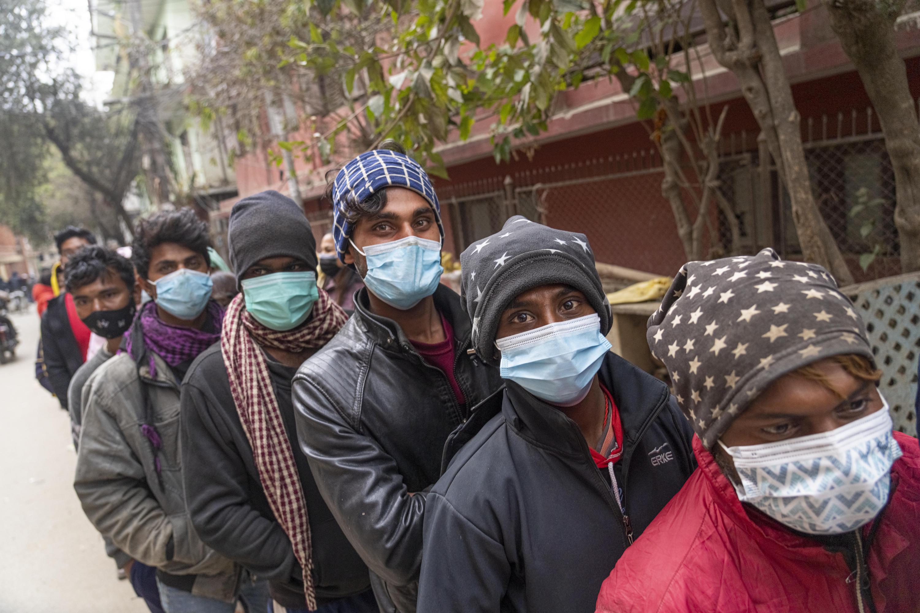 Nepal imposes tough restrictions as virus cases set record | AP News