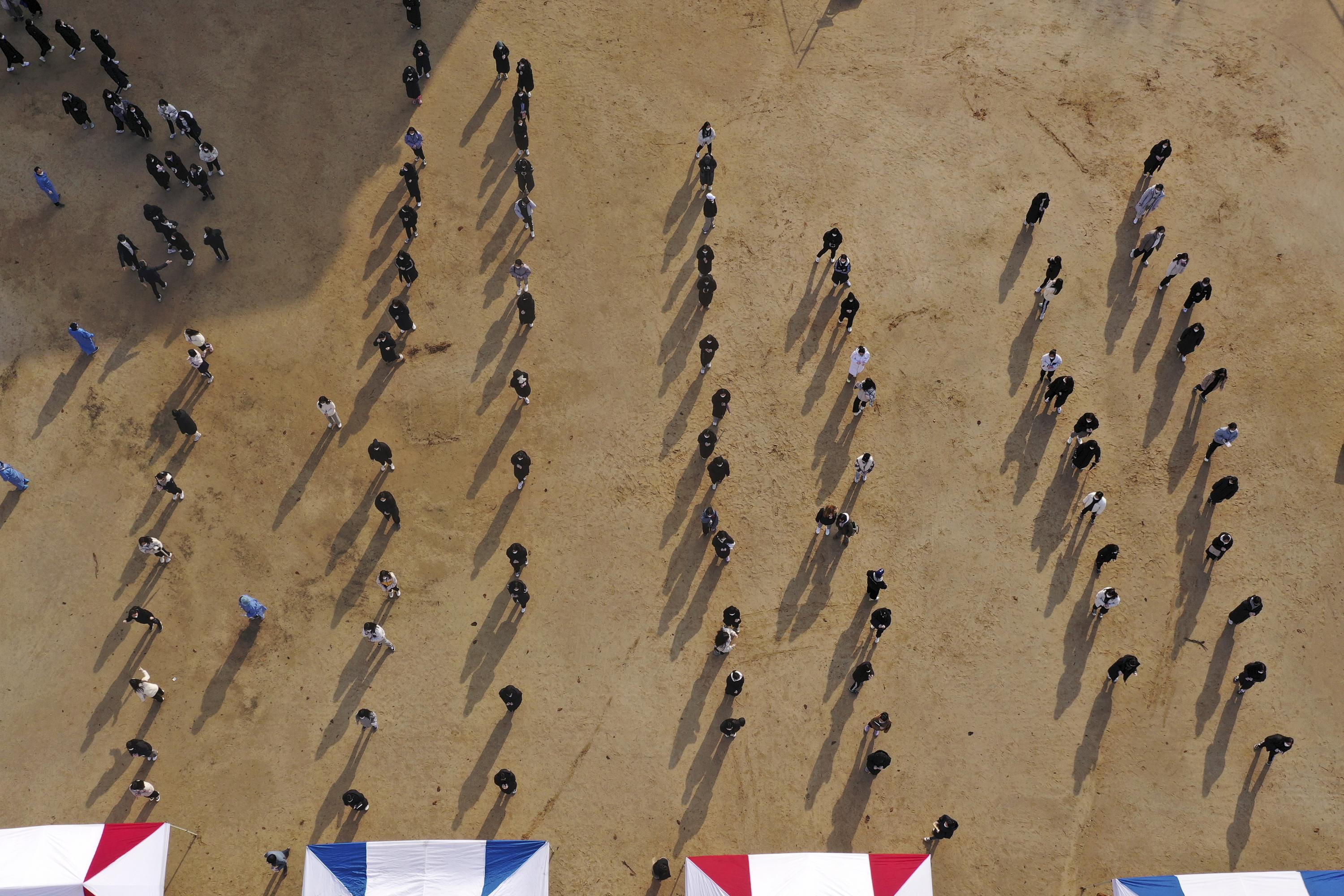 South Korea tightens social distancing to fight virus wave | AP News