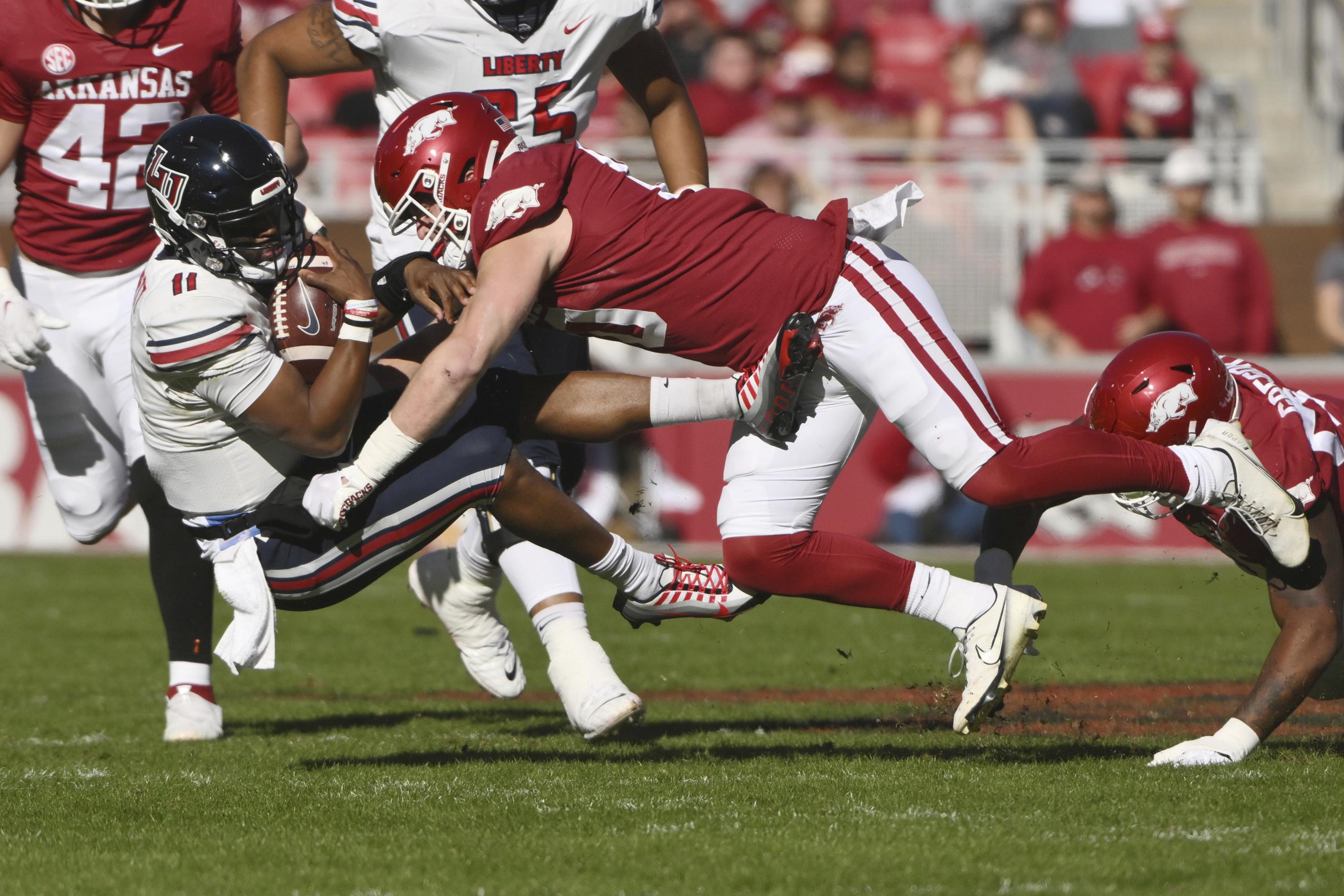 No. 23 Liberty gets goal-line stop, beats Arkansas 21-19 | AP News