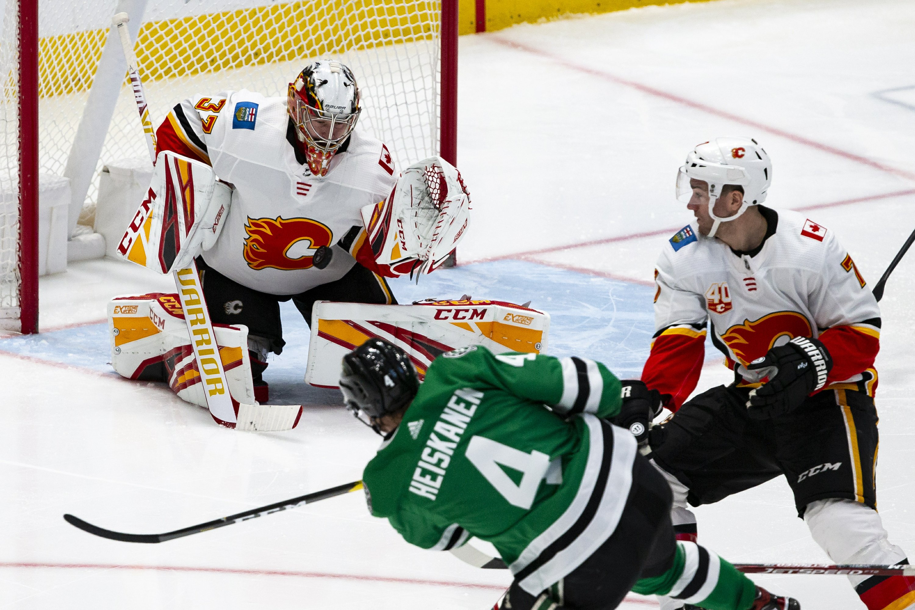 Flames score 3 power-play goals in 5-1 win over Stars | AP News