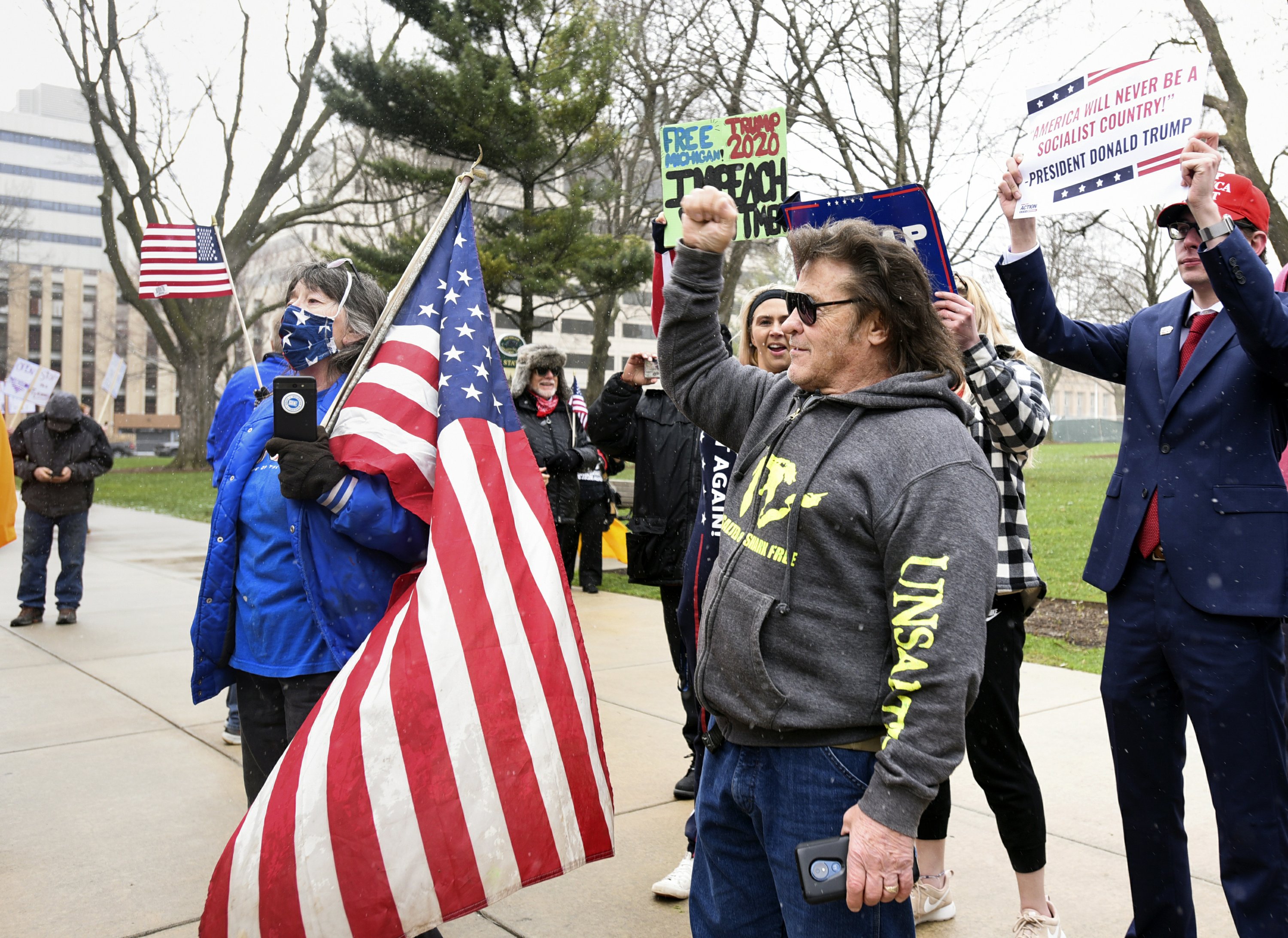Pro-Trump protesters push back on stay-at-home orders | AP News